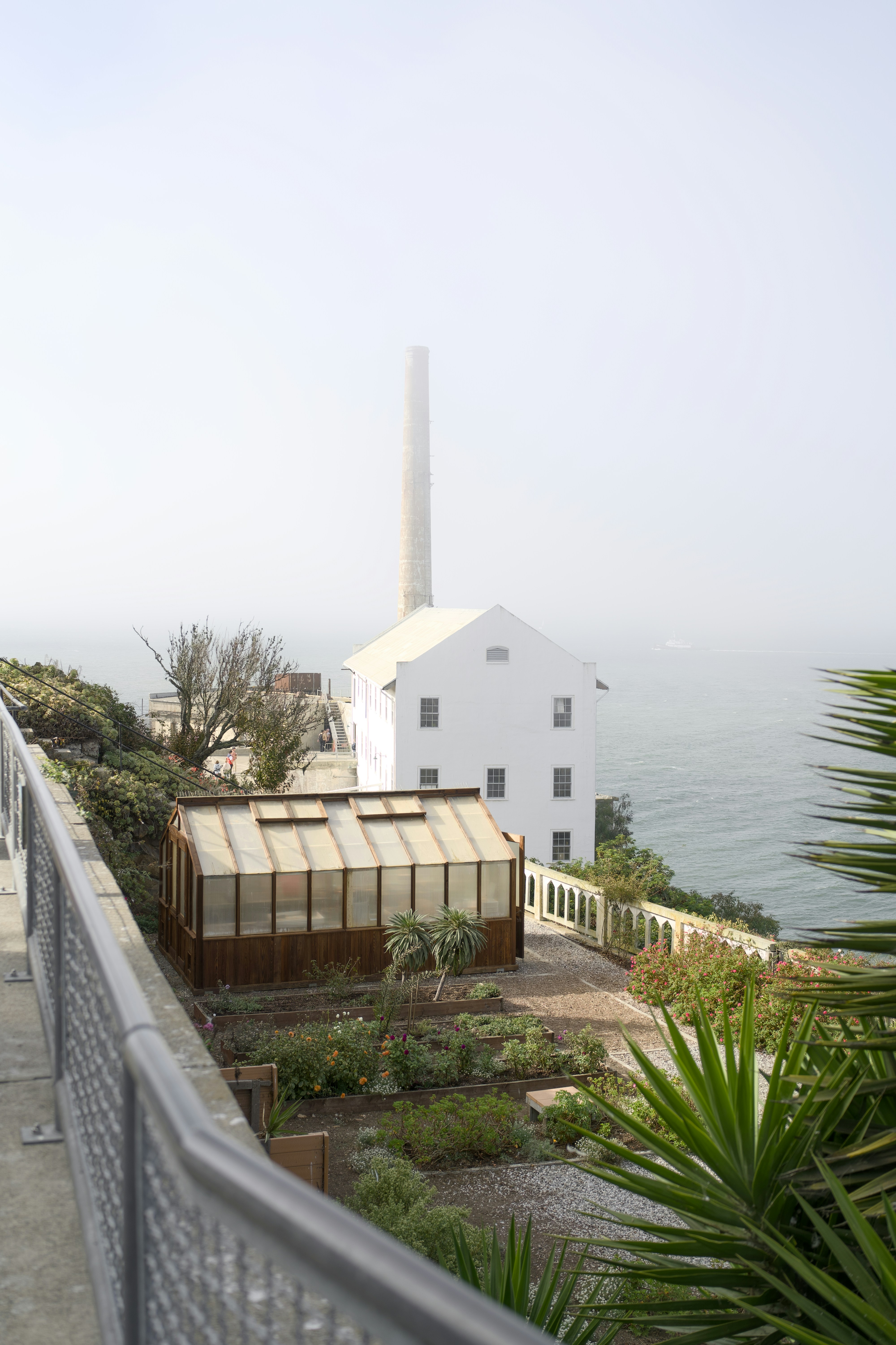 Coastal Studio by the Cliffs: A White Industrial Brick Along the Sea