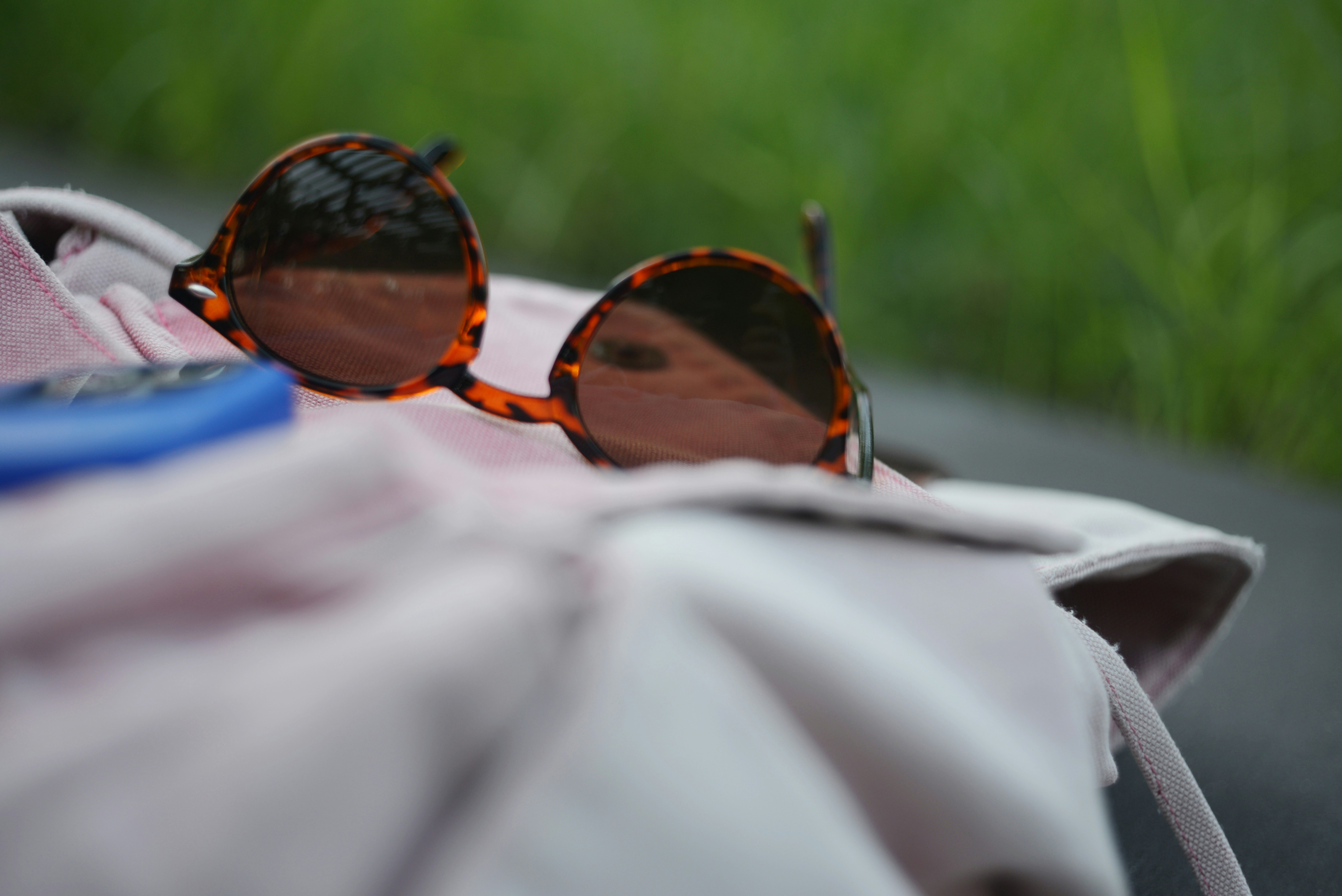 Tortoiseshell Sunglasses Resting on Soft Gear