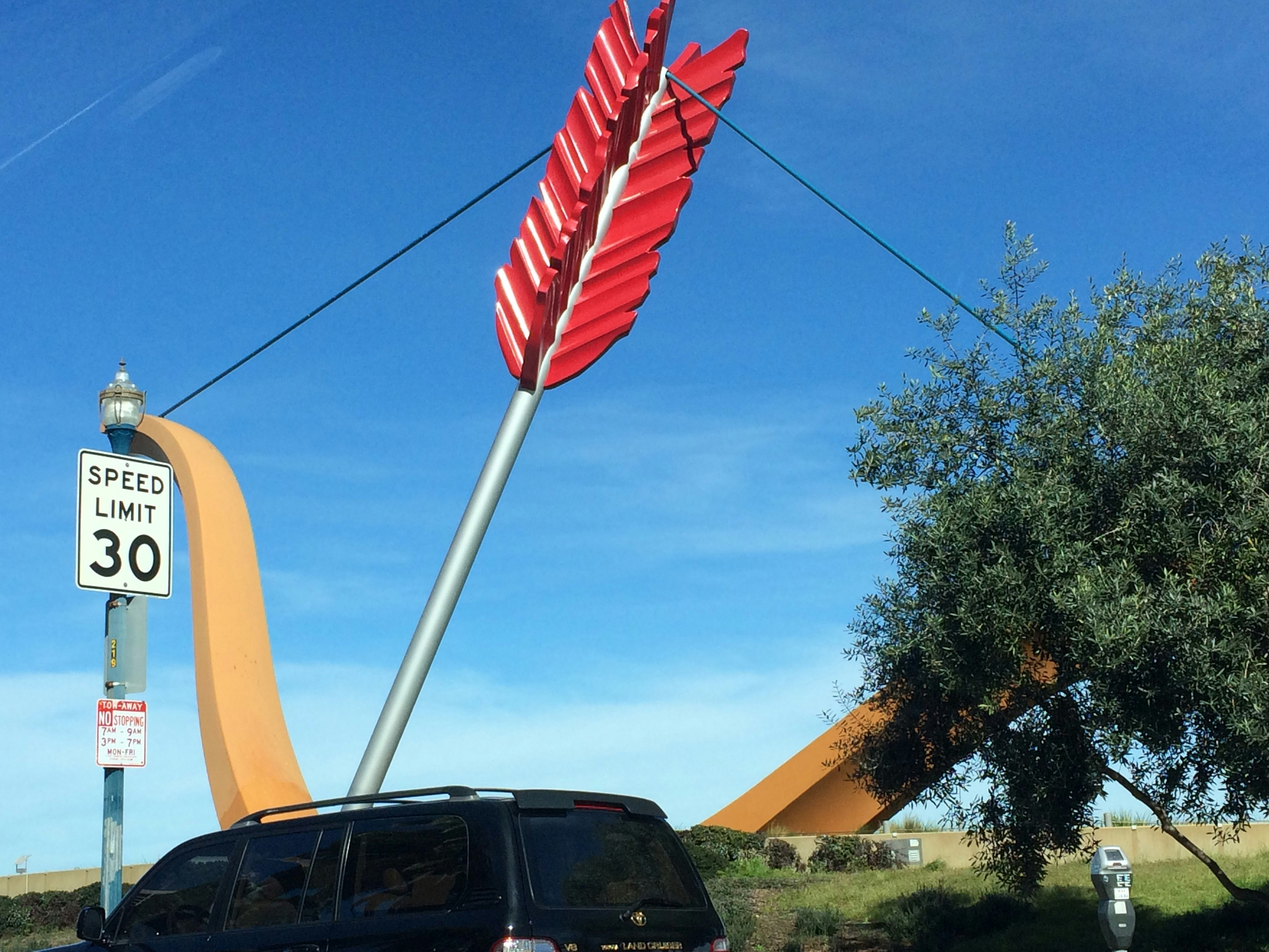 Arrow Overdrive: A Neon Arch Surges Over a Street Scene