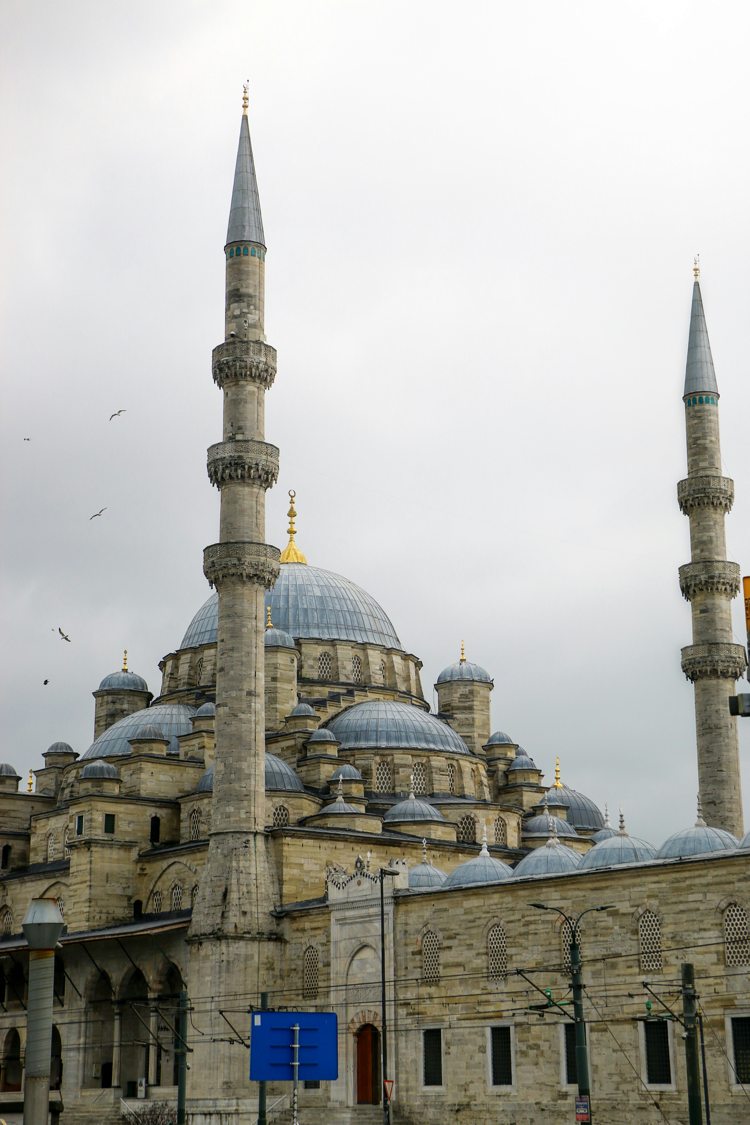 Minarets and Domes: A Mosque's Silhouette Against a Cloudy Sky