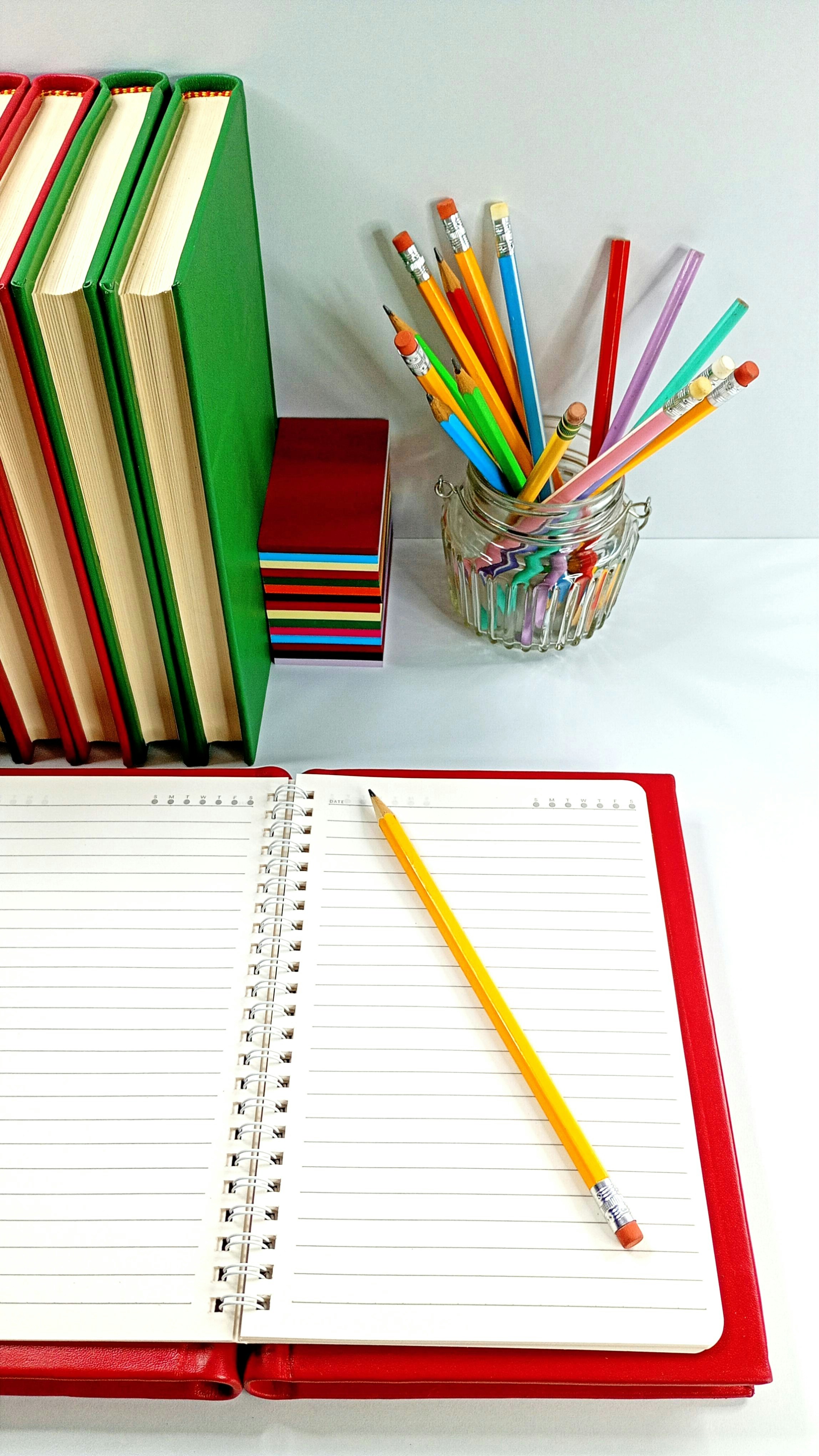 Pencils in a Glass, Notebooks Ready: A Colorful Desk Scene