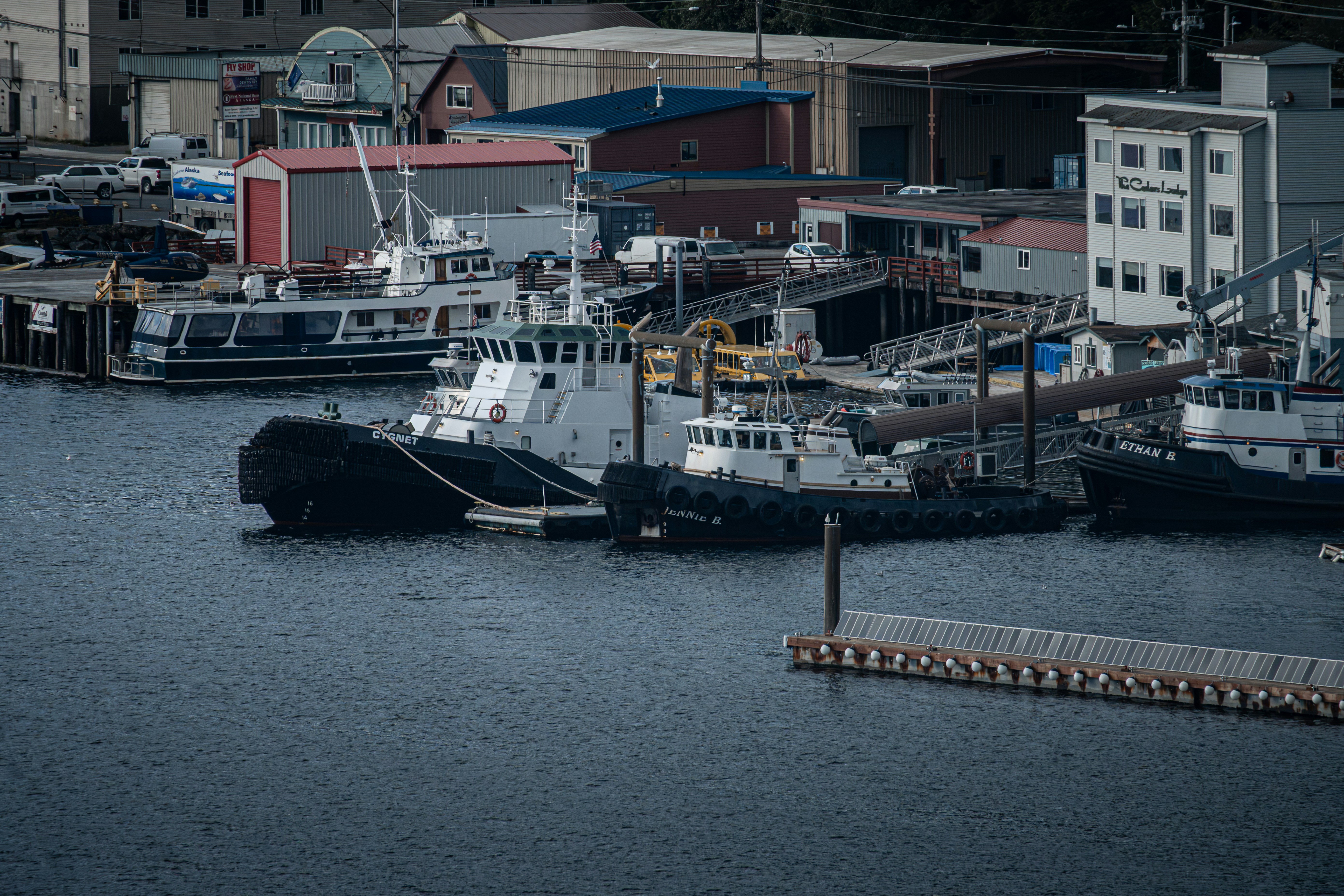 Harbor Fleet at Dusk: Boats Anchorage Along Industrial Waterfront