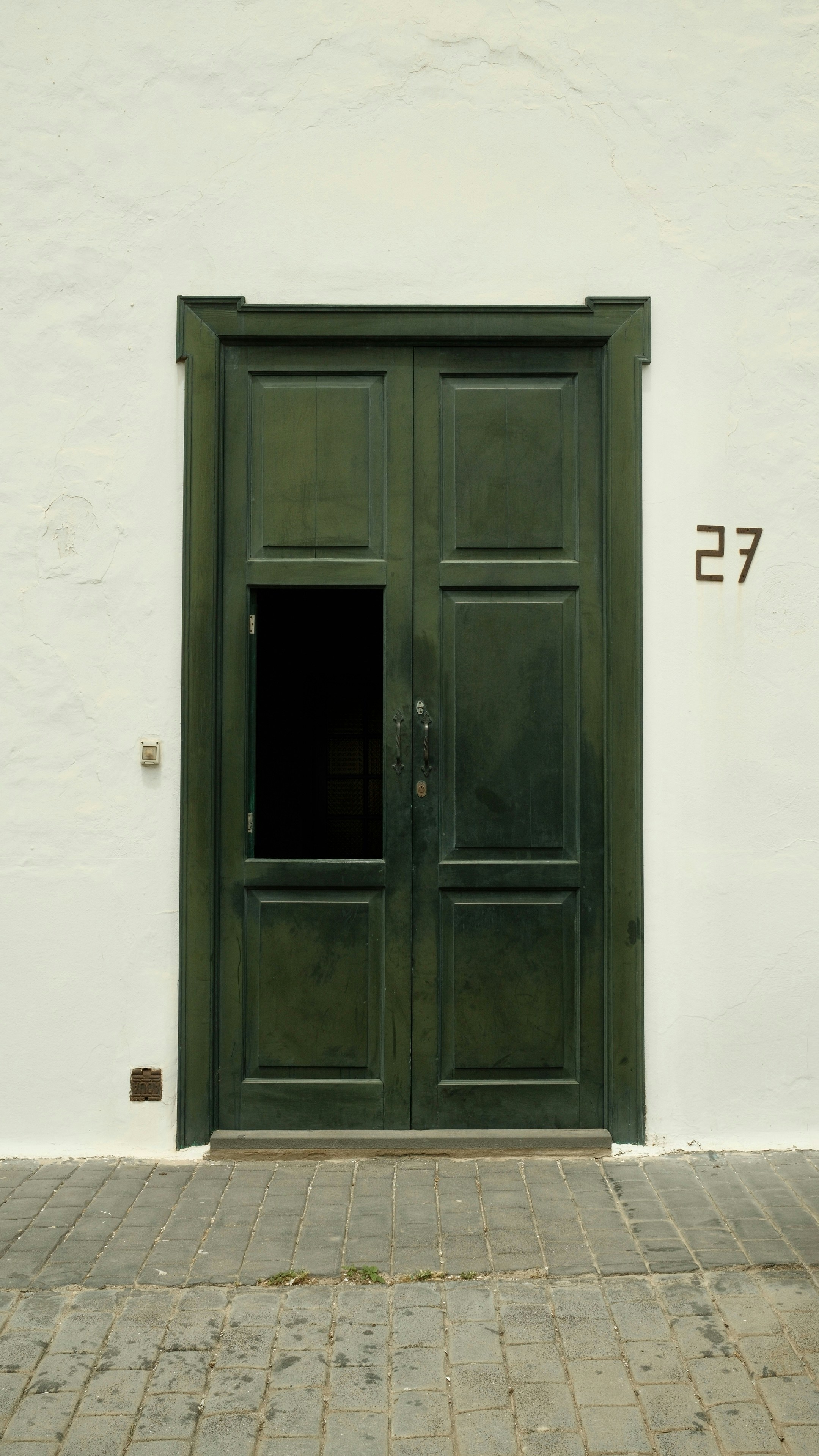 Green Portal on Pale Street: A Doorway to Quiet Mystery