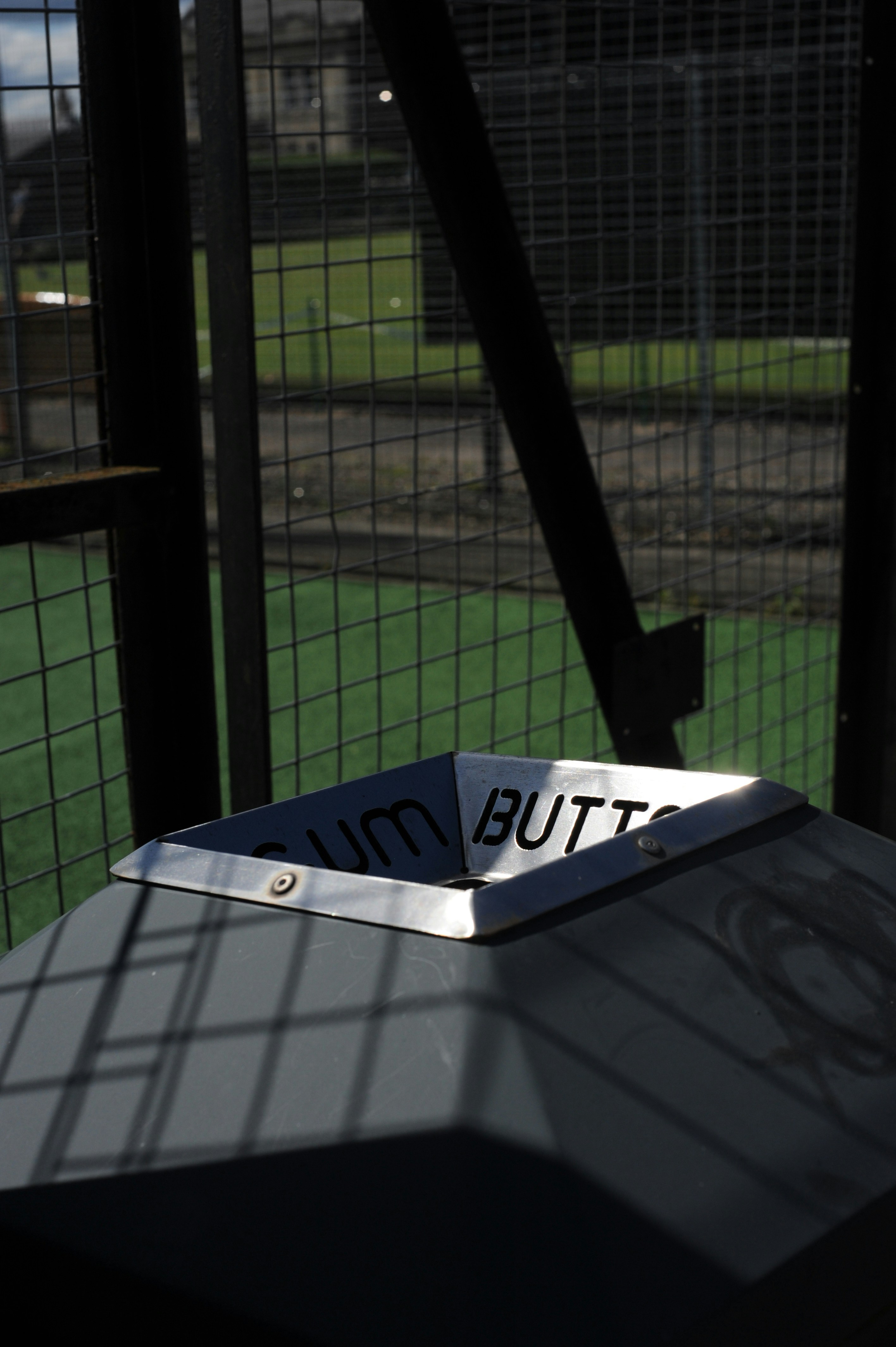 Industrial Cage Shadows over a Stadium Heat-Lloor Edge