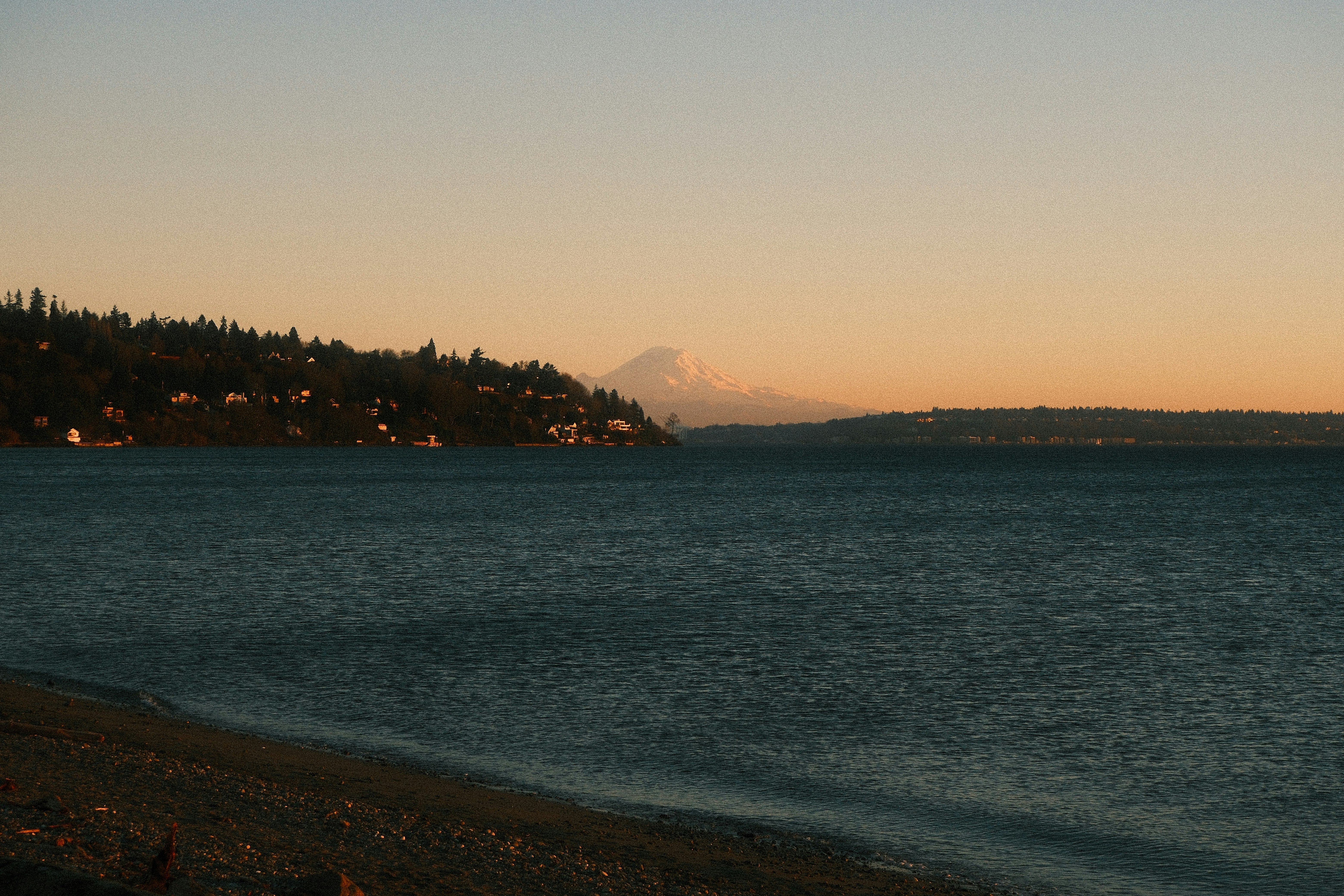 Dawn over the Quiet Shore with Snow-Capped Peak