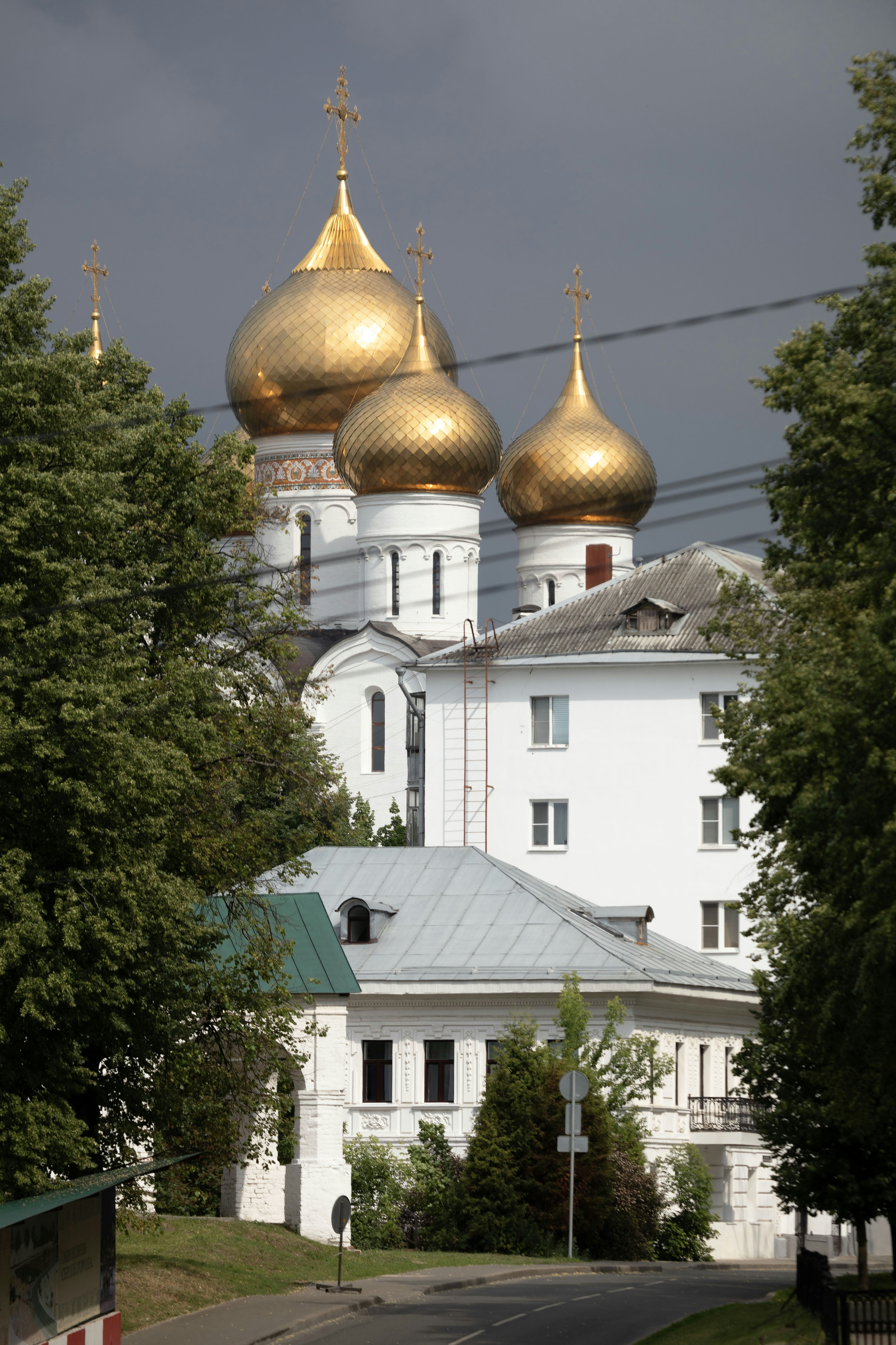 Gilded onion domes rising above a quiet street