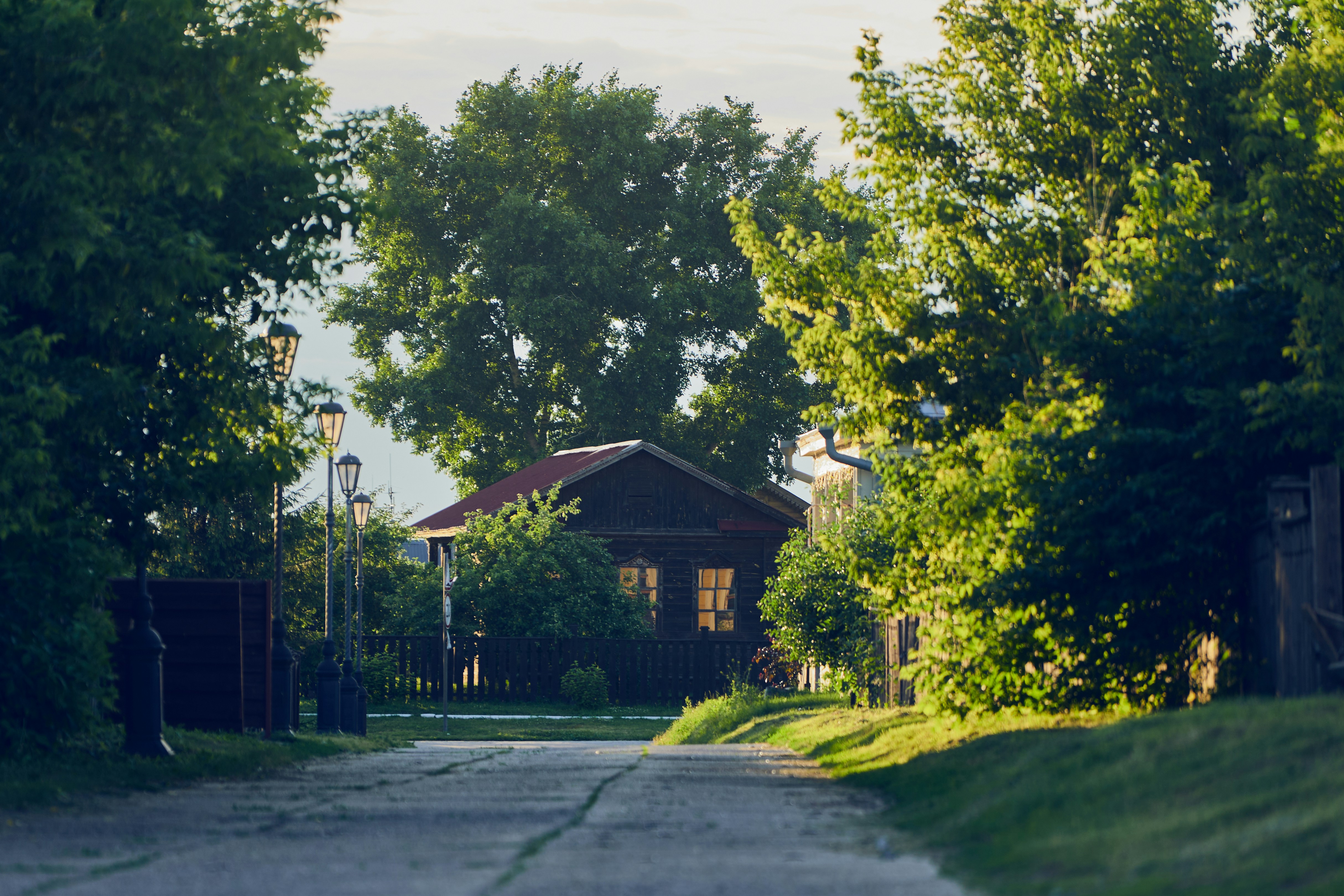 Quiet Street In Front Of a Cozy Wooden House