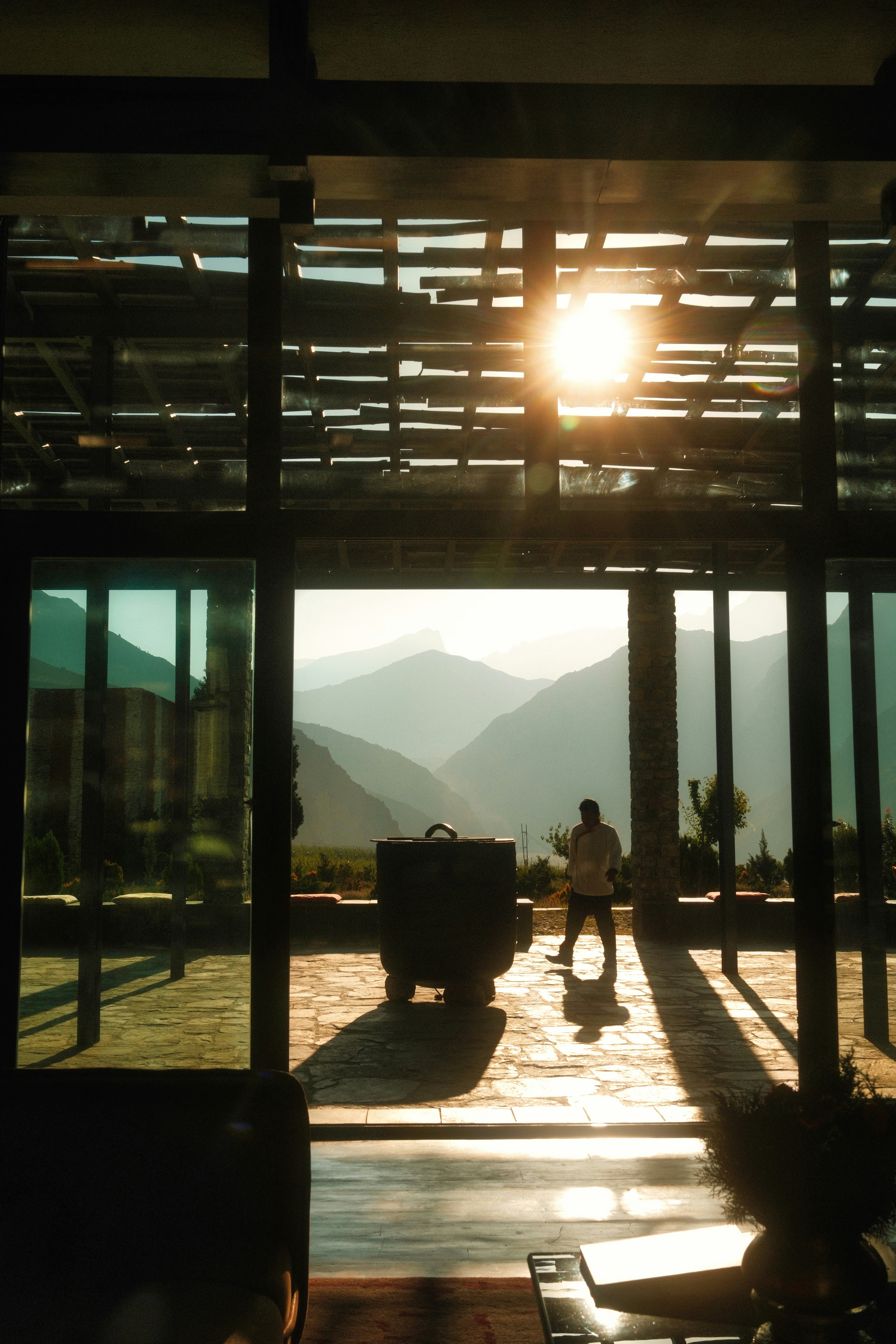 Sunlit Glass Hallway Overlooking Mountain Vale
