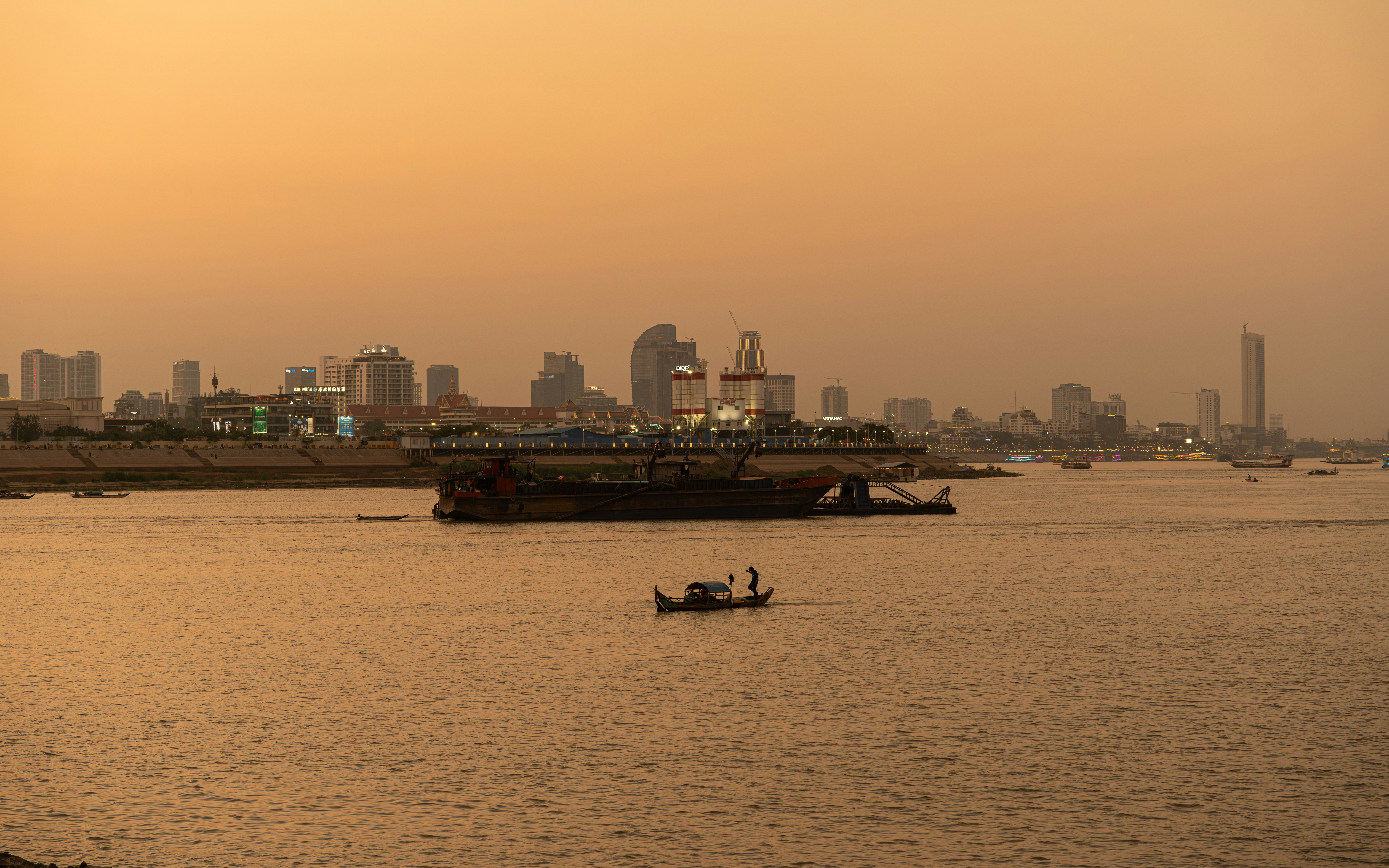 Sunset Over the River: Lanterns of a Distant City