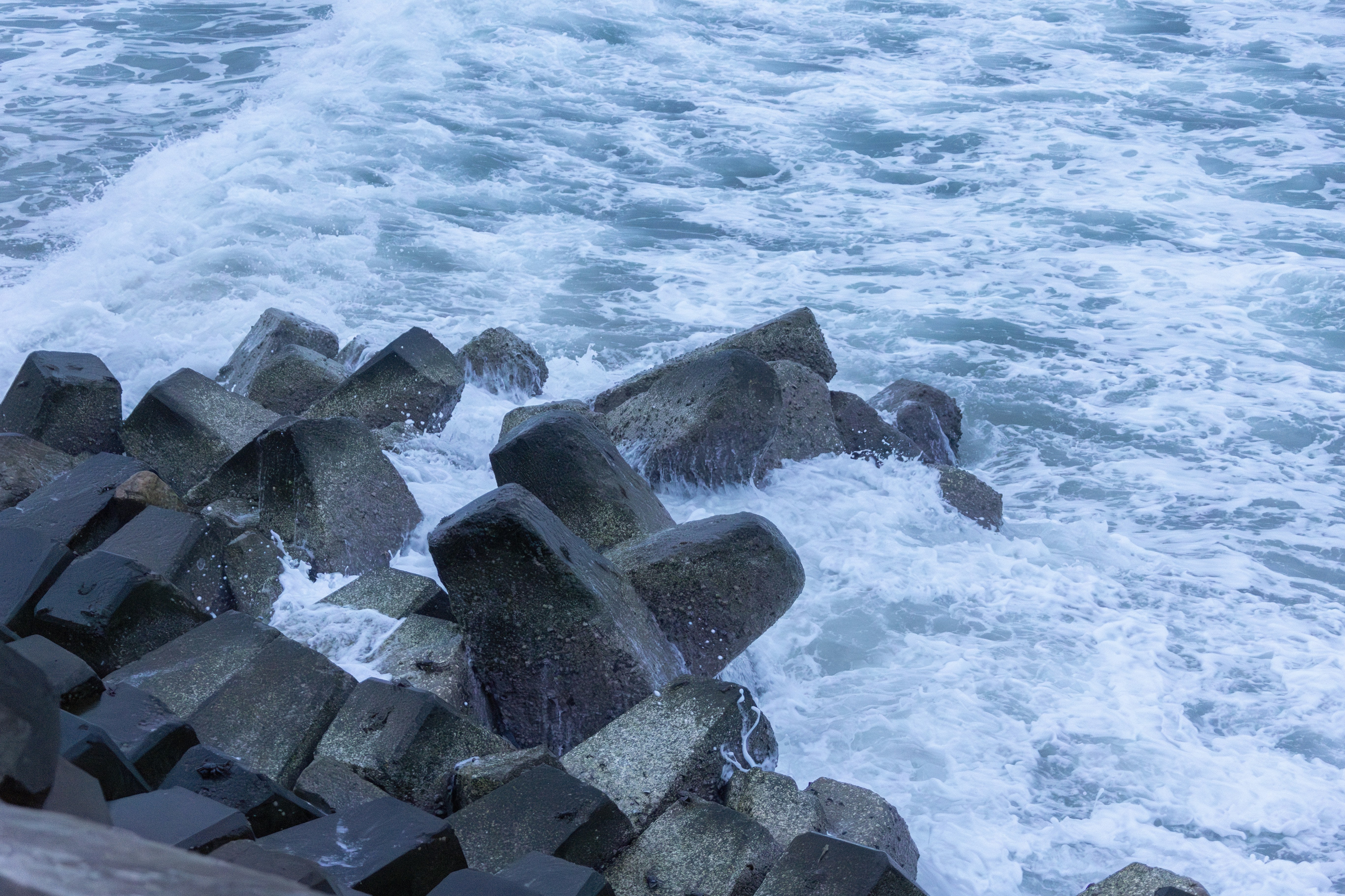 Rough Breakwater: Waves Reclaim the Concrete Jagged Edge