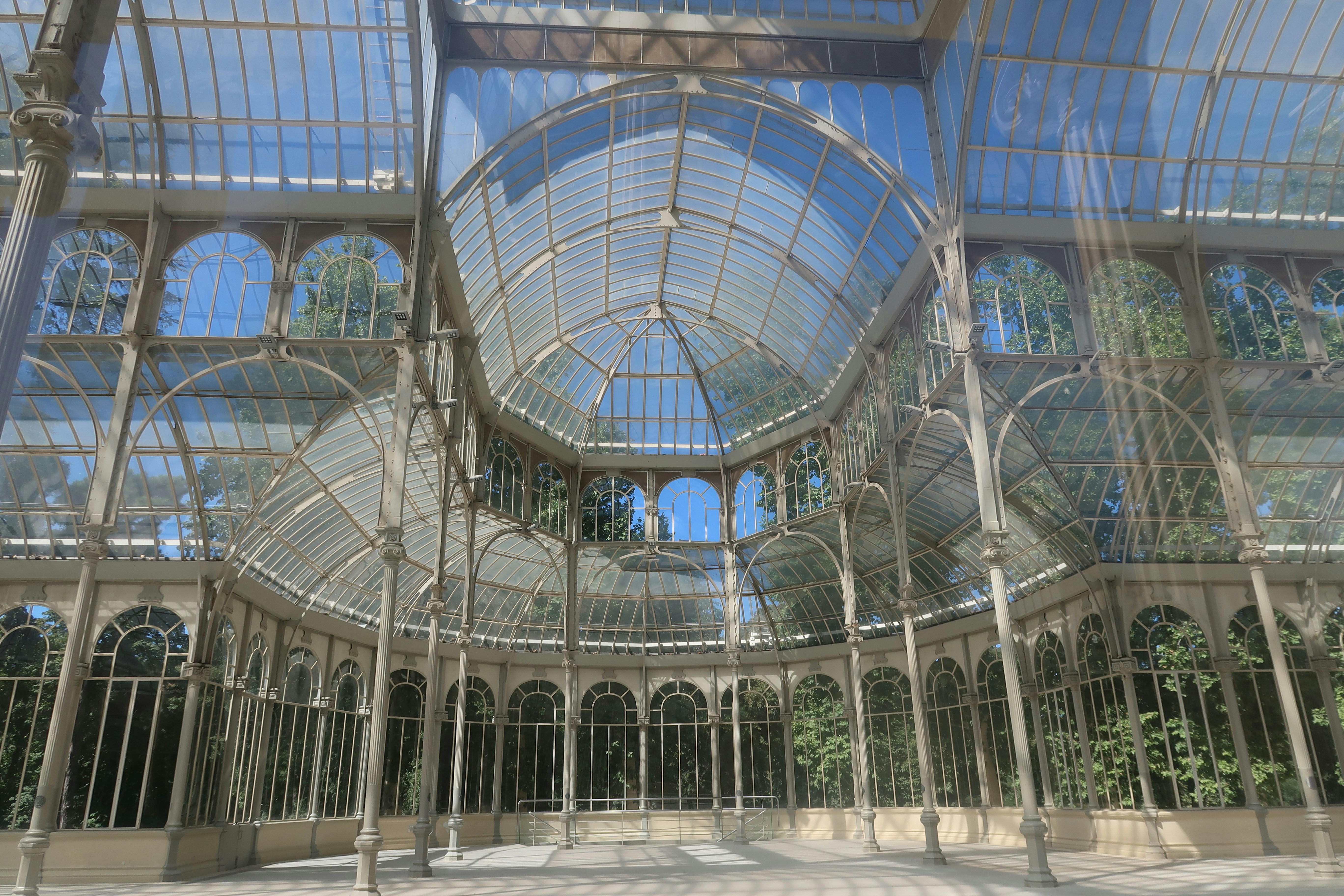 Sunlit Convergence: A Glasshouse Cathedral of Steel and Sky