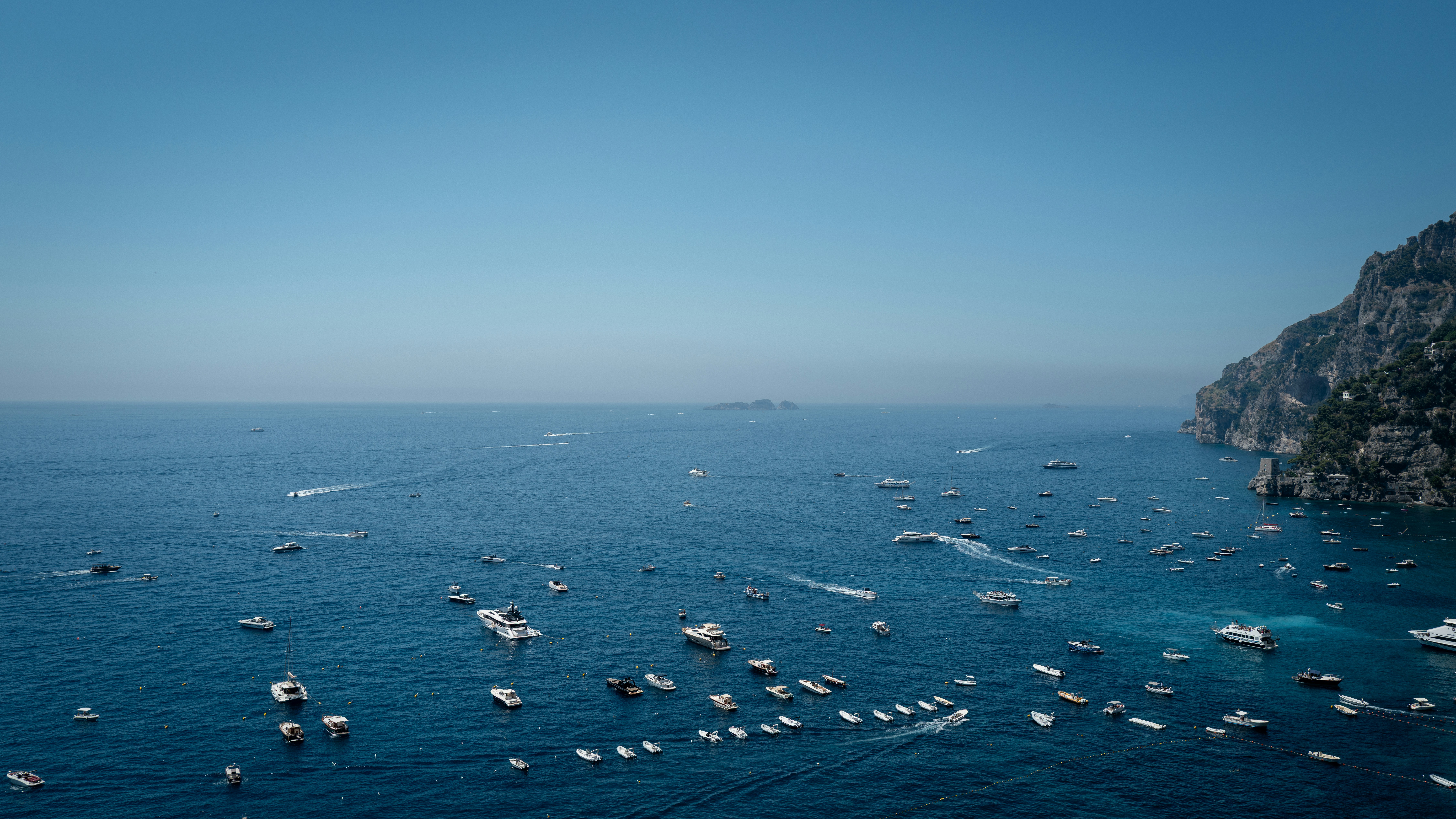 Harbor of Boats Beneath a Clear Coastal Sky