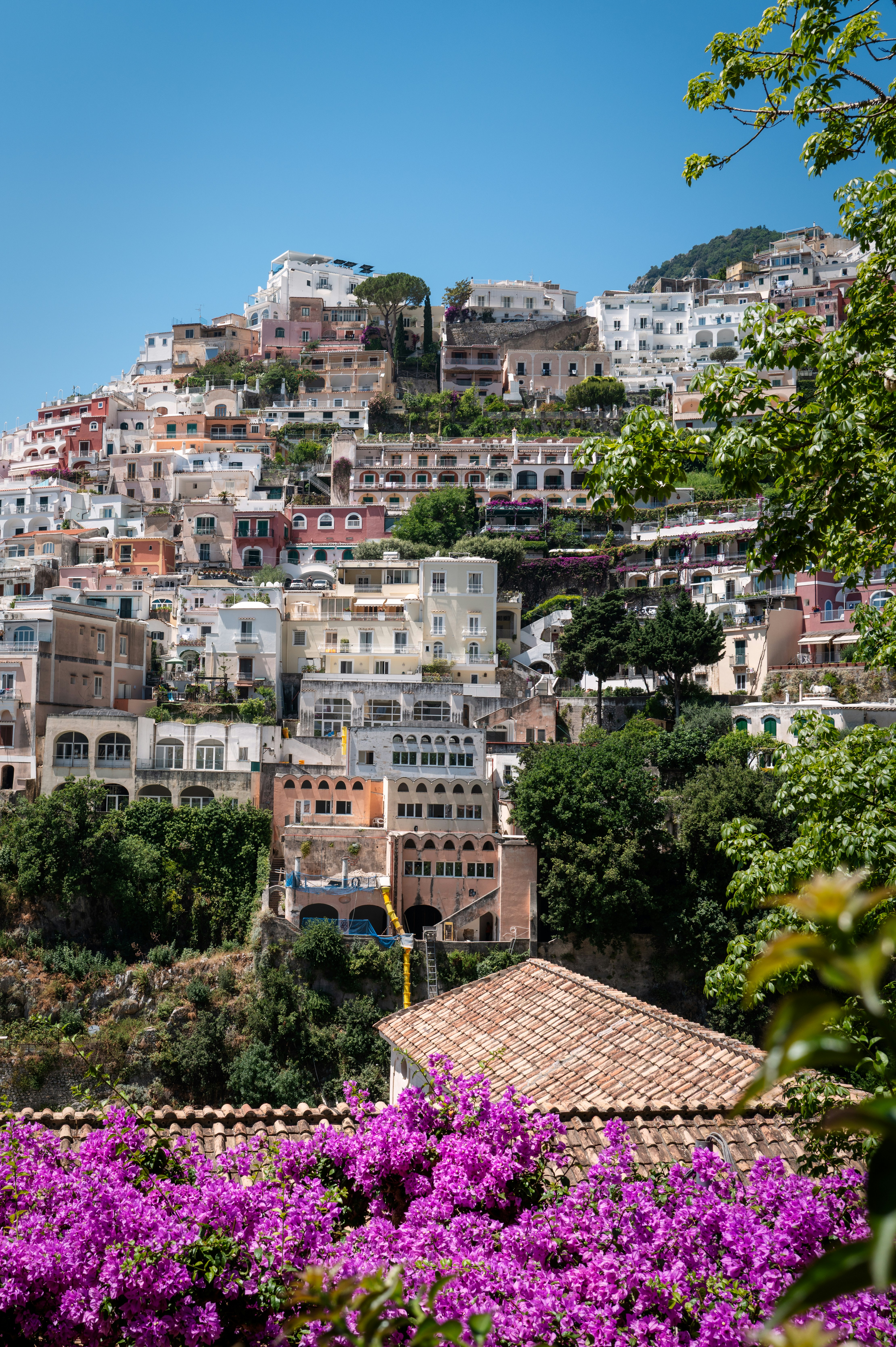 Colorful hillside village cascade under a crisp blue sky
