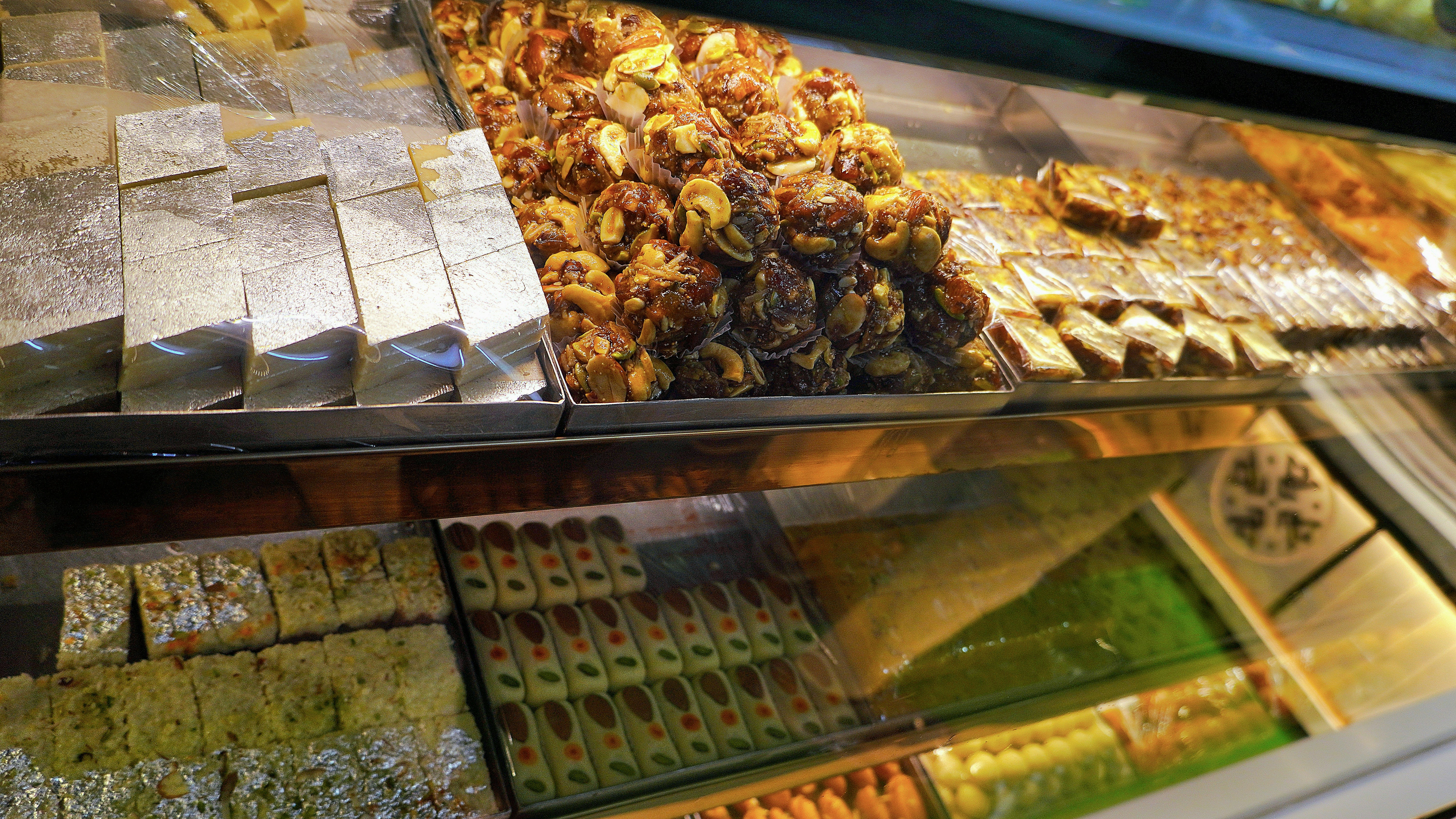 Assorted pastries and confections in a glass display case