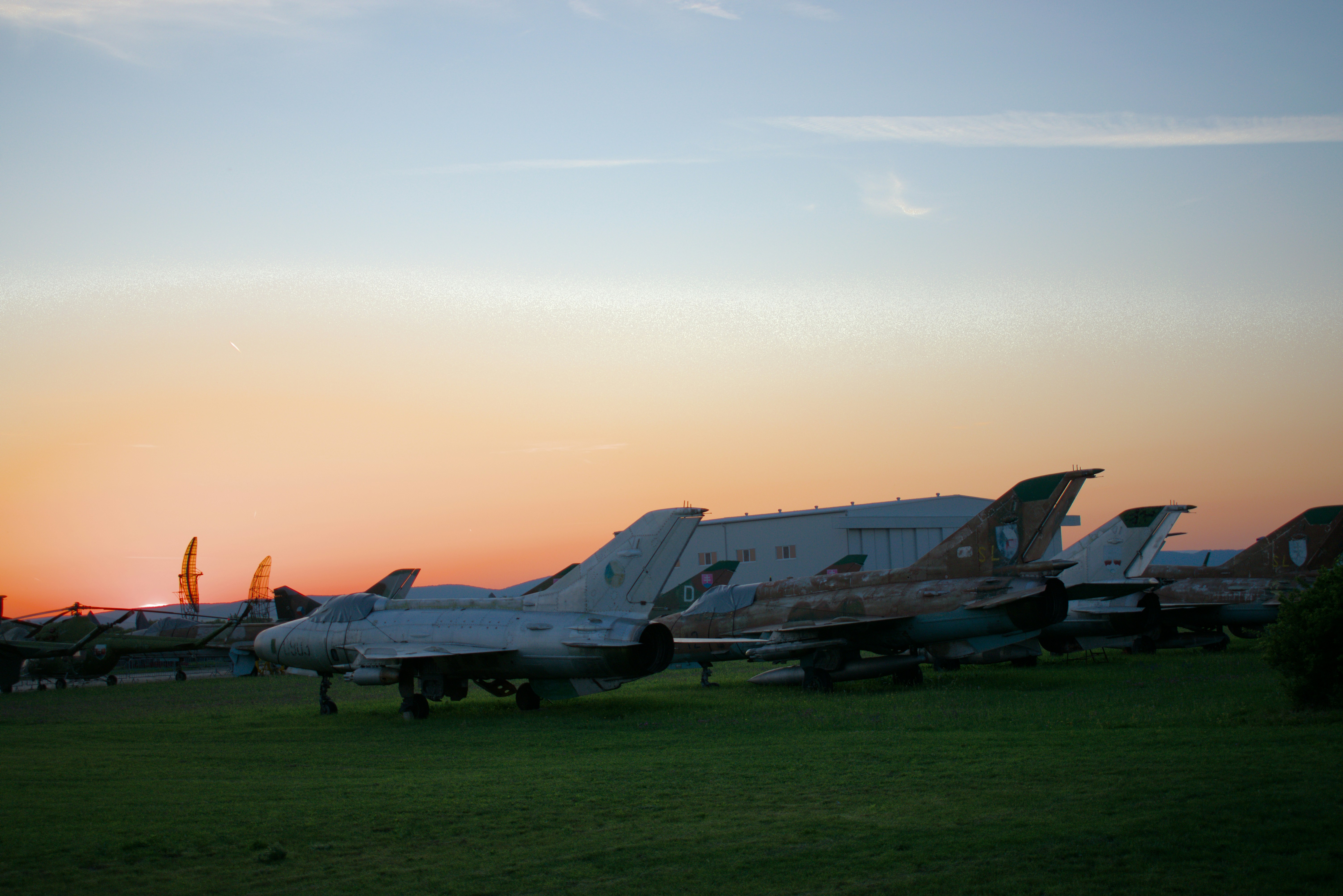 Sunset Hangar: Lost Jets Rest on the Grass