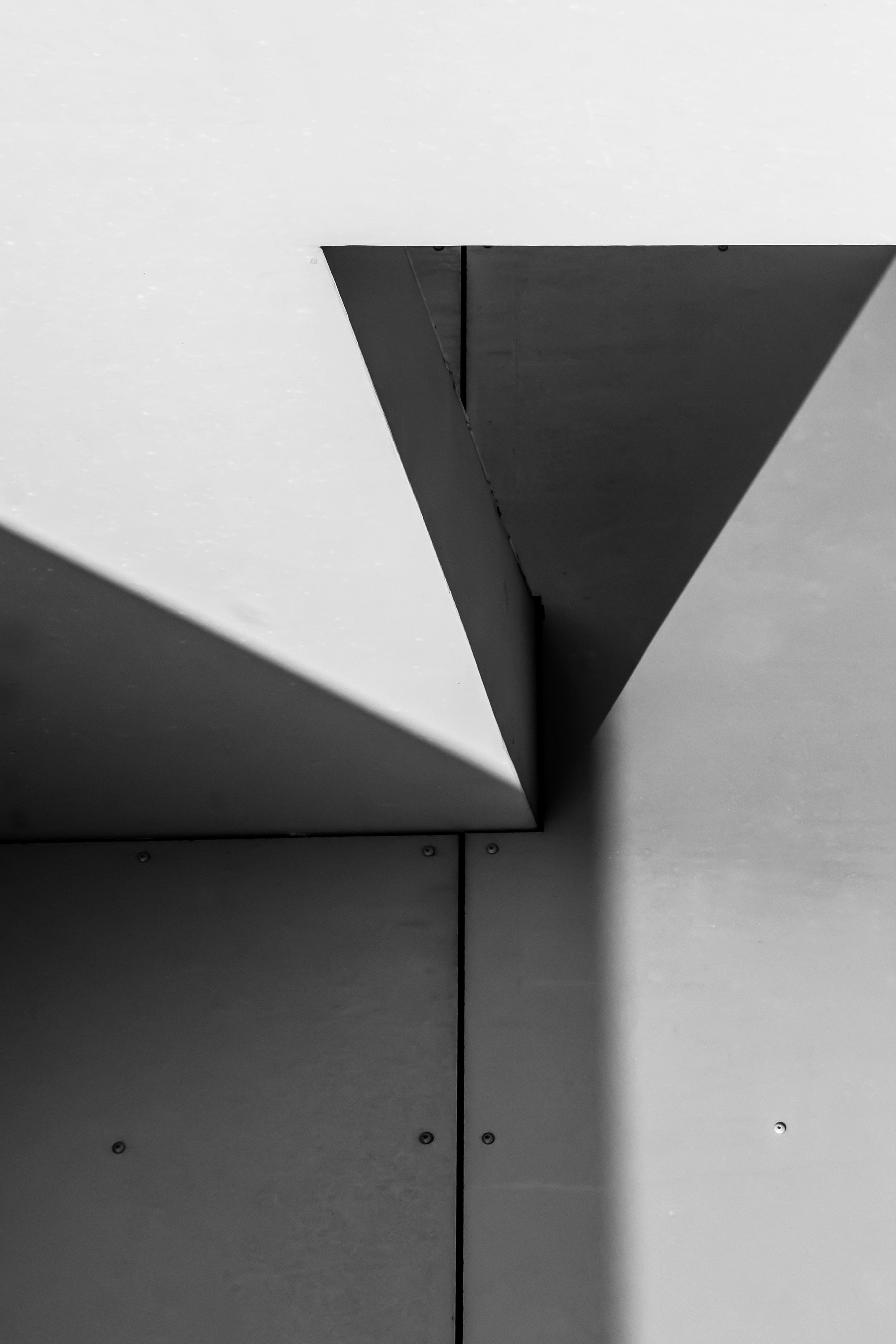 Triangular Shadow Play on Steel Facade