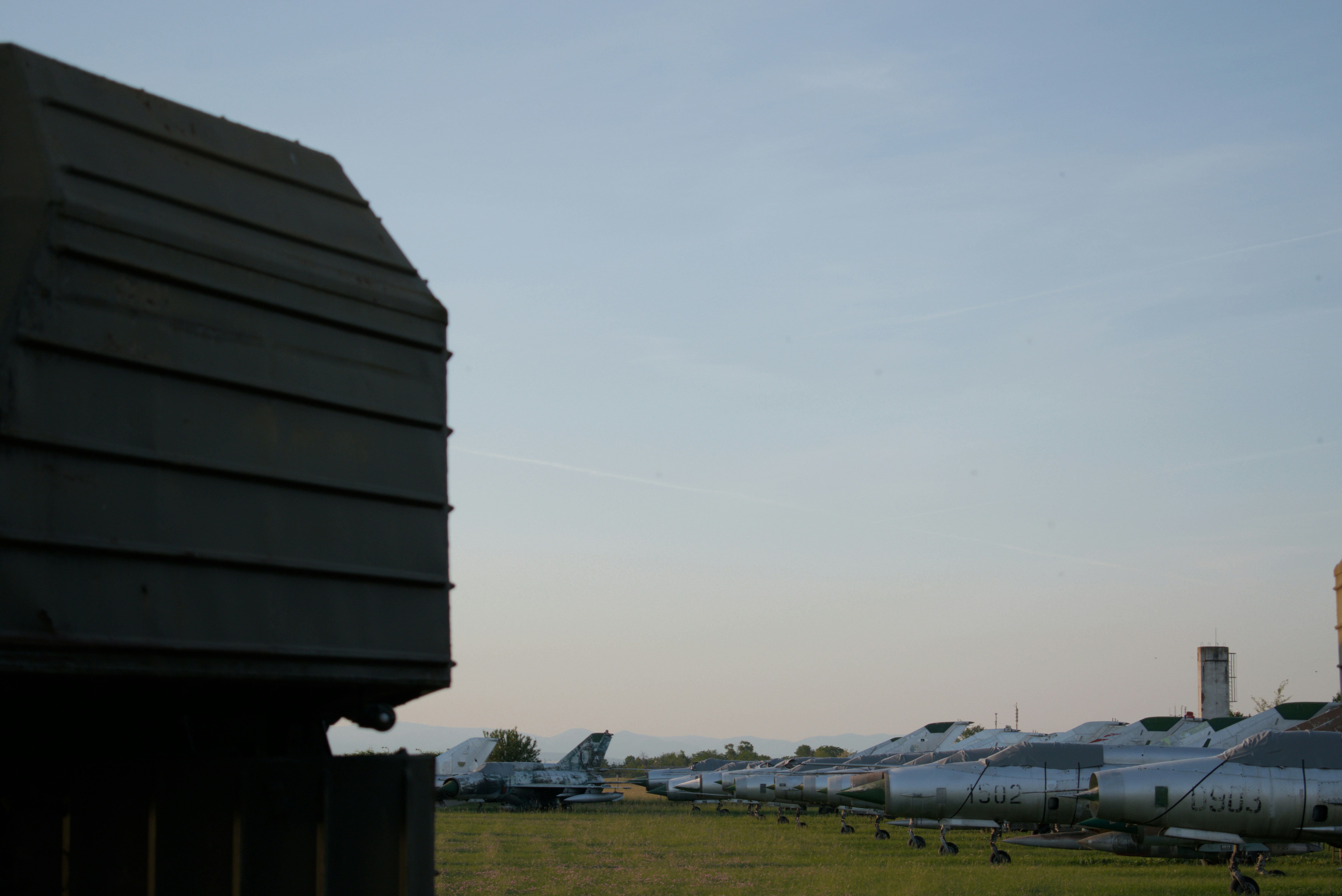 Midfield Dragon: A Quiet Ramp of Parked Aircraft under a Wide Sky