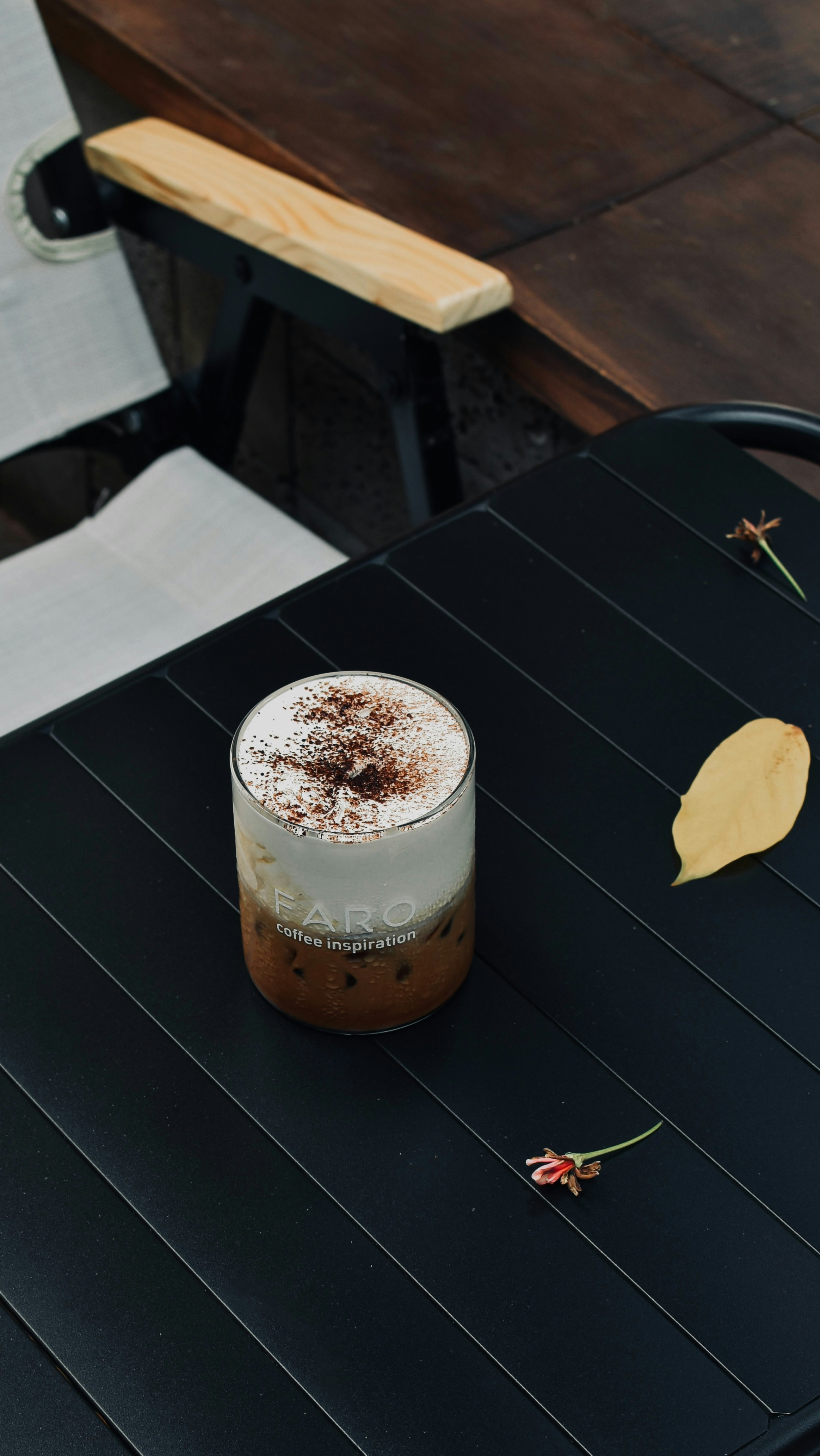 Midday Chill: A Glass of Icy Sweetness on a Dark Table