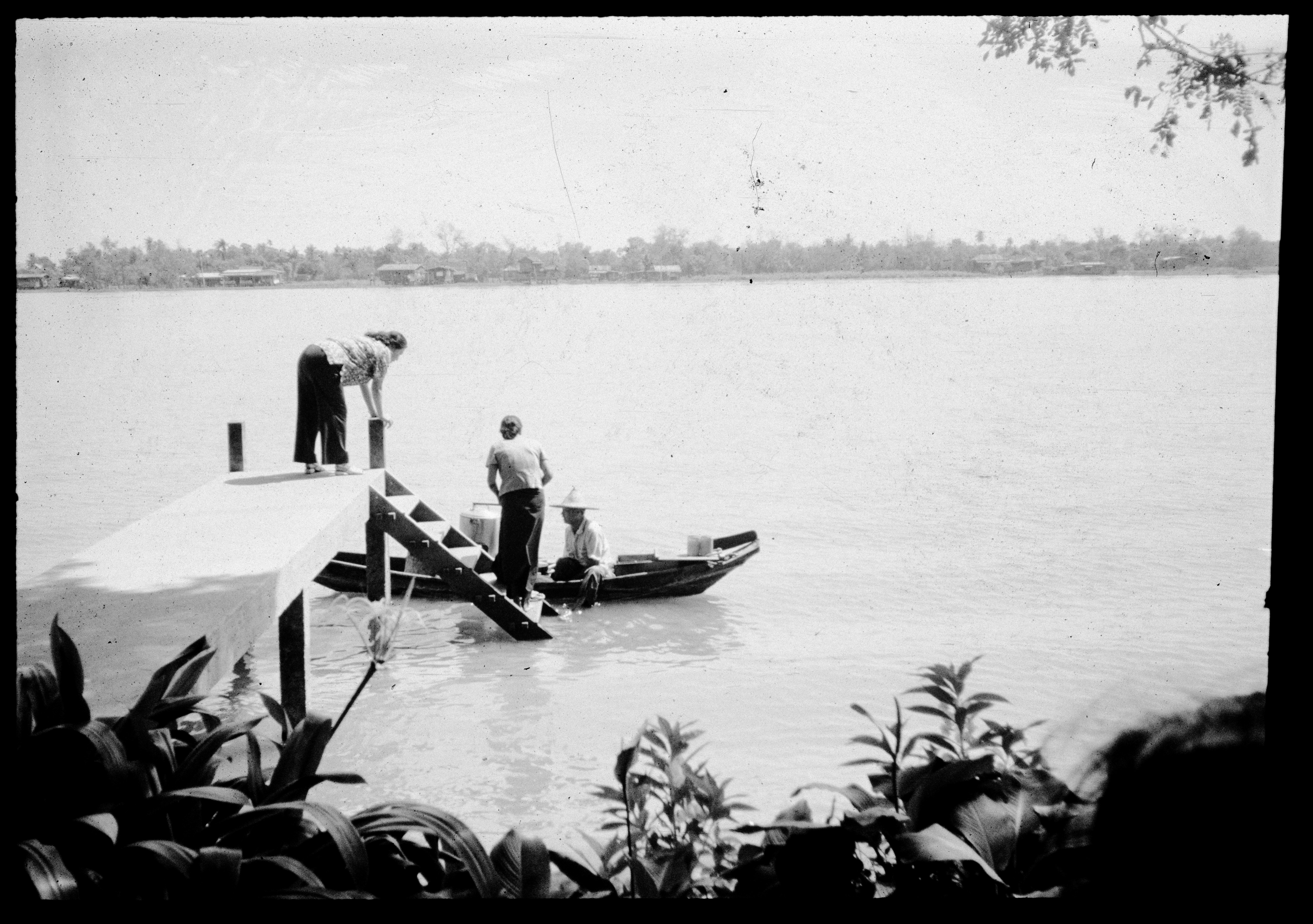 Dockside Preparation: A Quiet Moment by the River