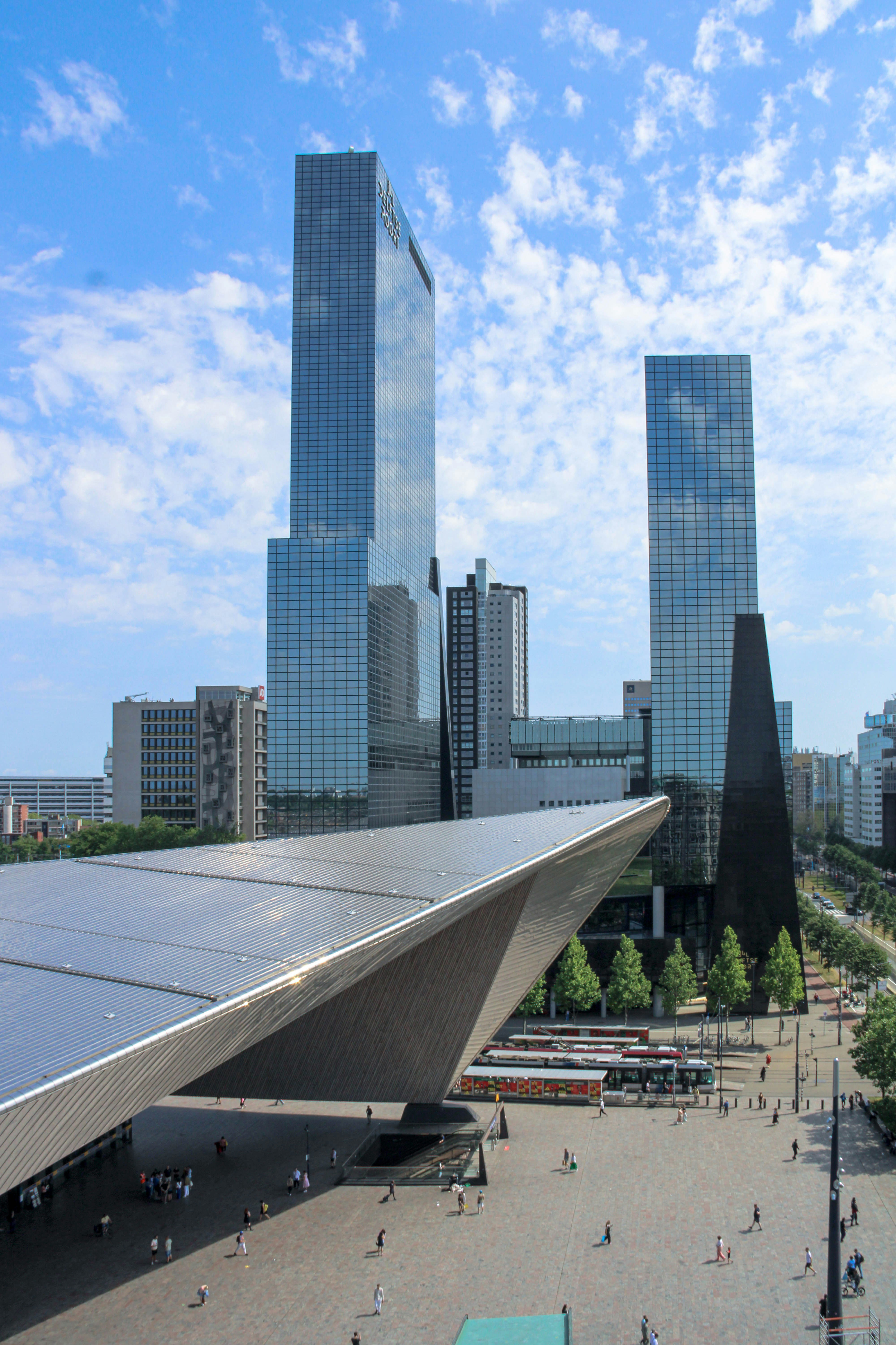 Skyline at the Concourse: Modern Towers and a Sloped Canopy