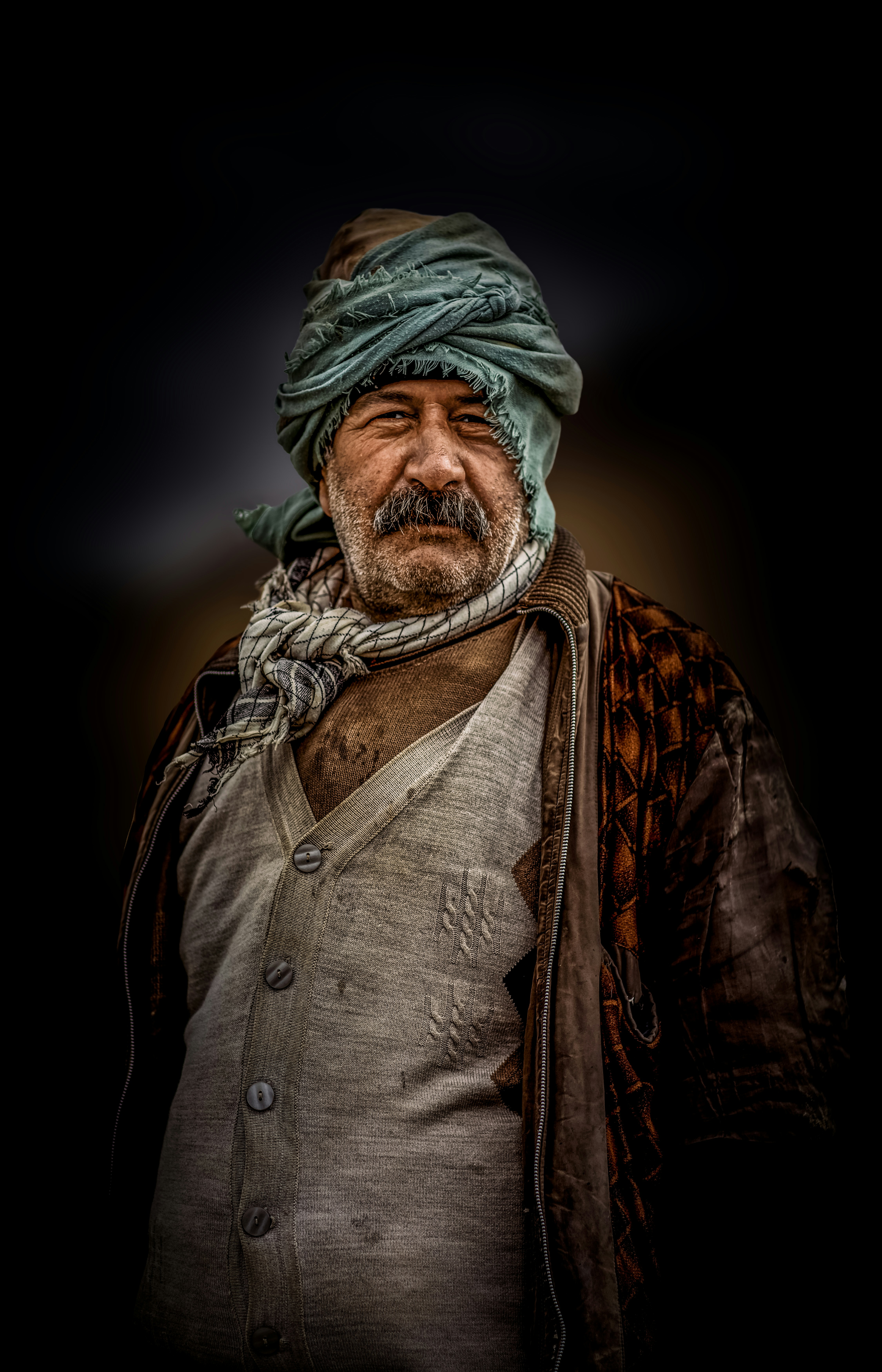 Coal-woven Turban and Weathered Gaze: A Portrait of Endurance
