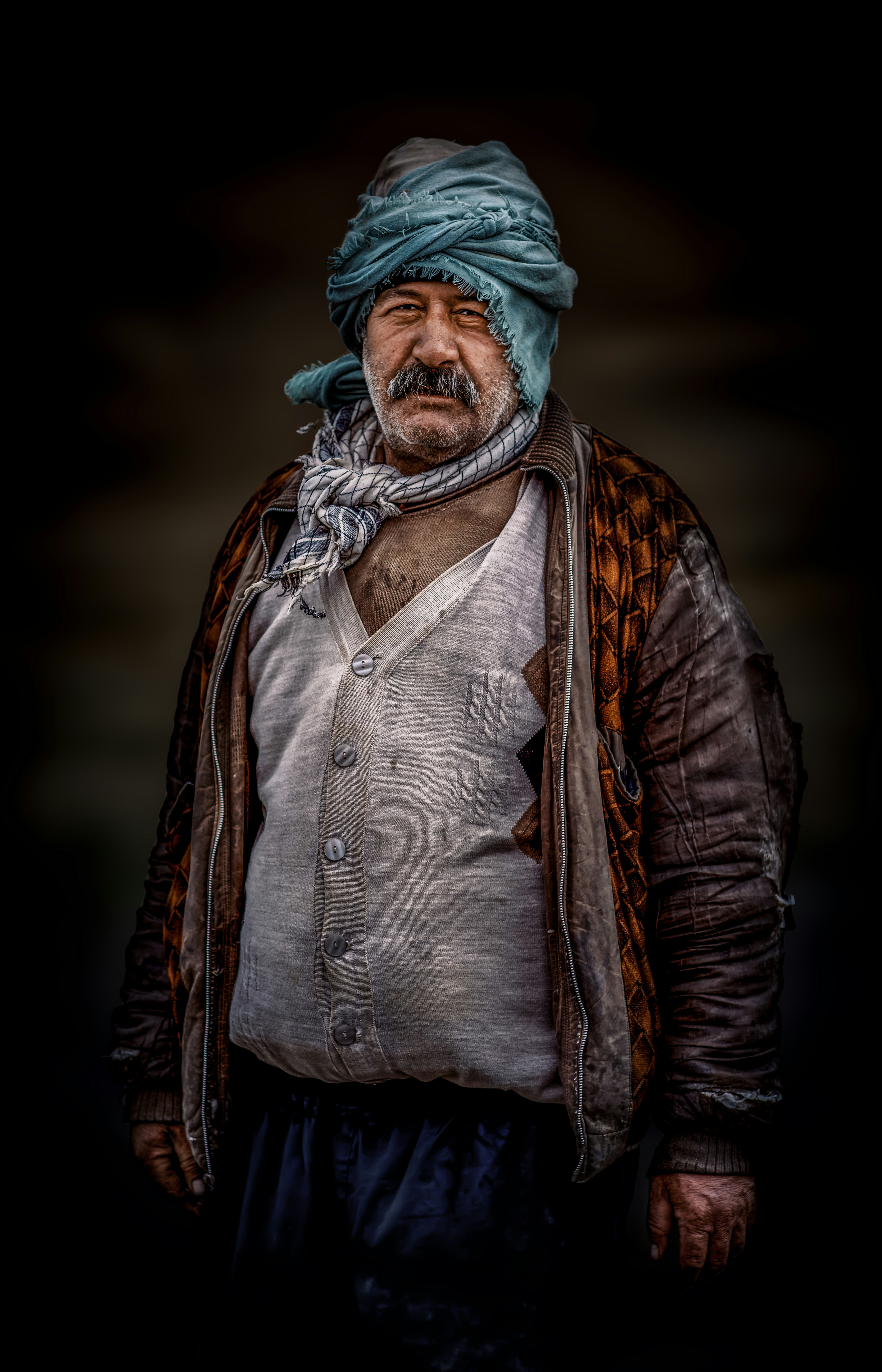 Portrait of Resolve: A Weathered Man in a Turquoise Turban