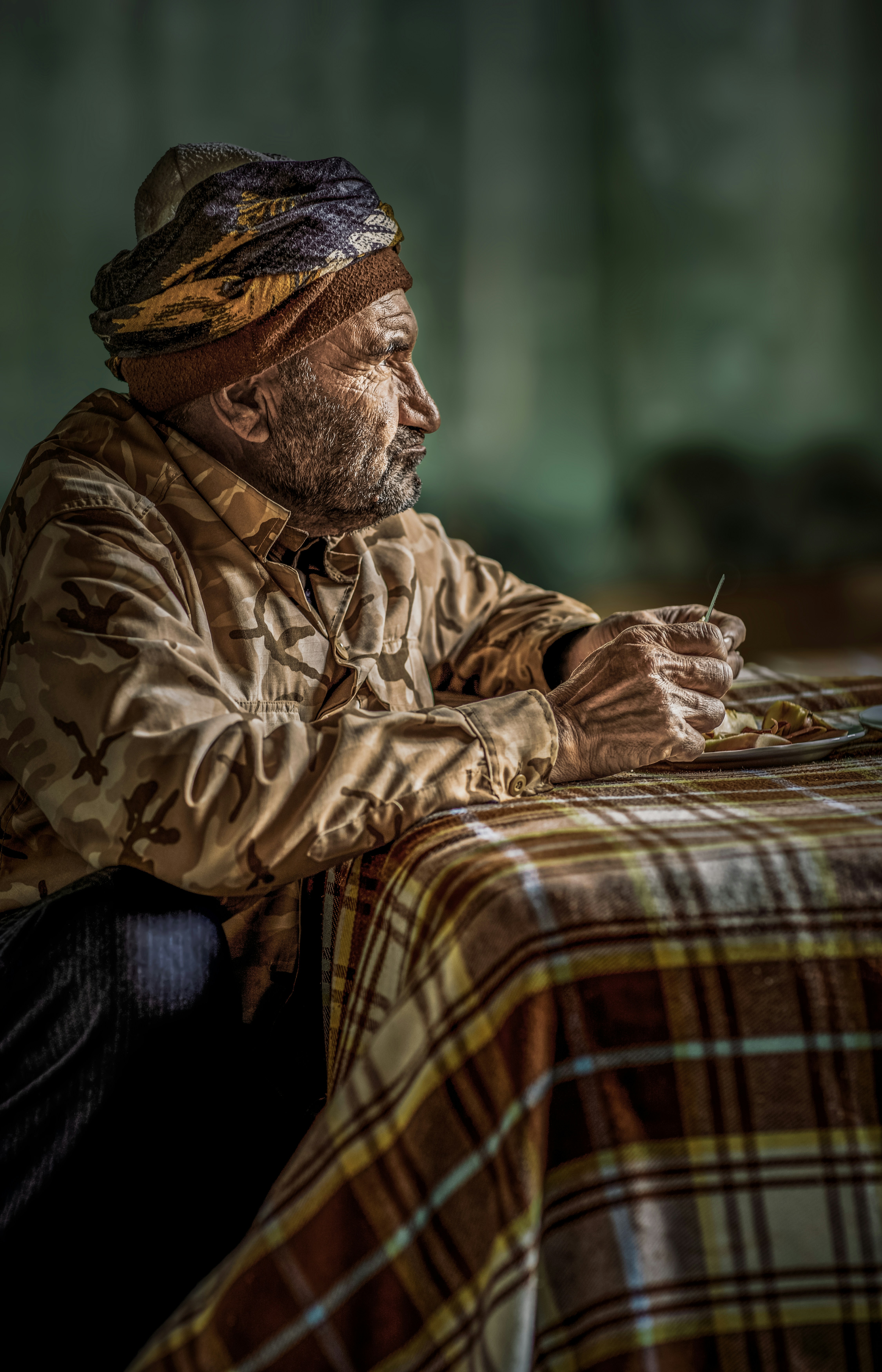 Seasoned Hands: A Moment of Reflection at the Table