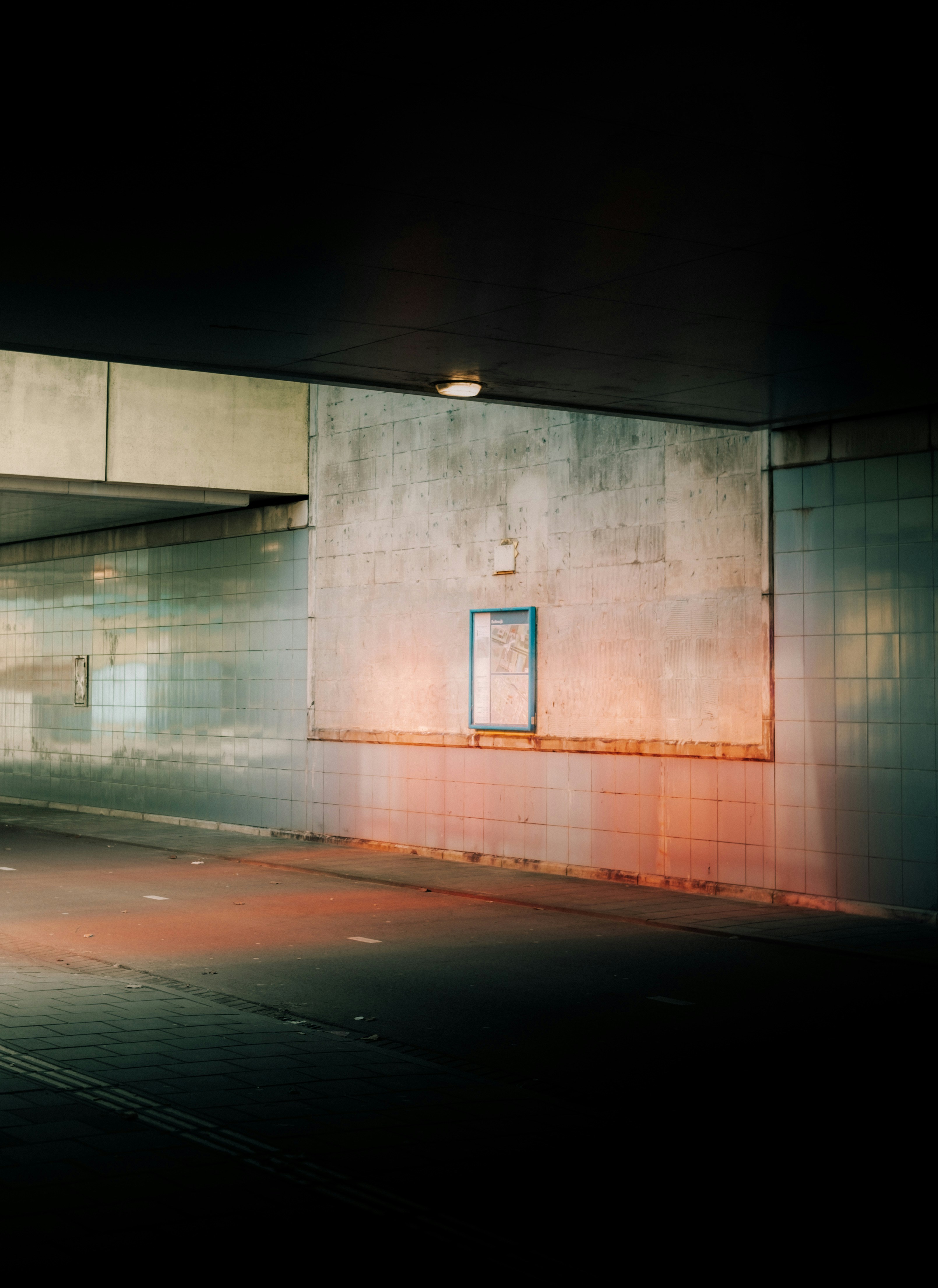 Underpass Quiet: A Framed Moment with Neon Echoes