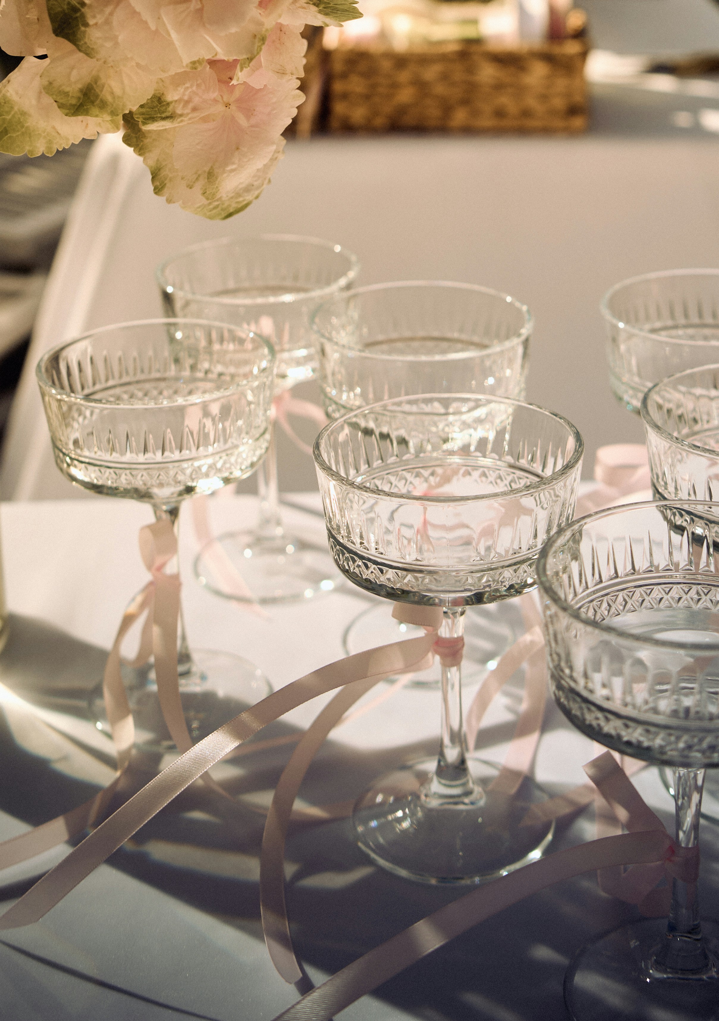 Crystal Echoes: A Row of Glass Goblets Under Soft Dinner Light