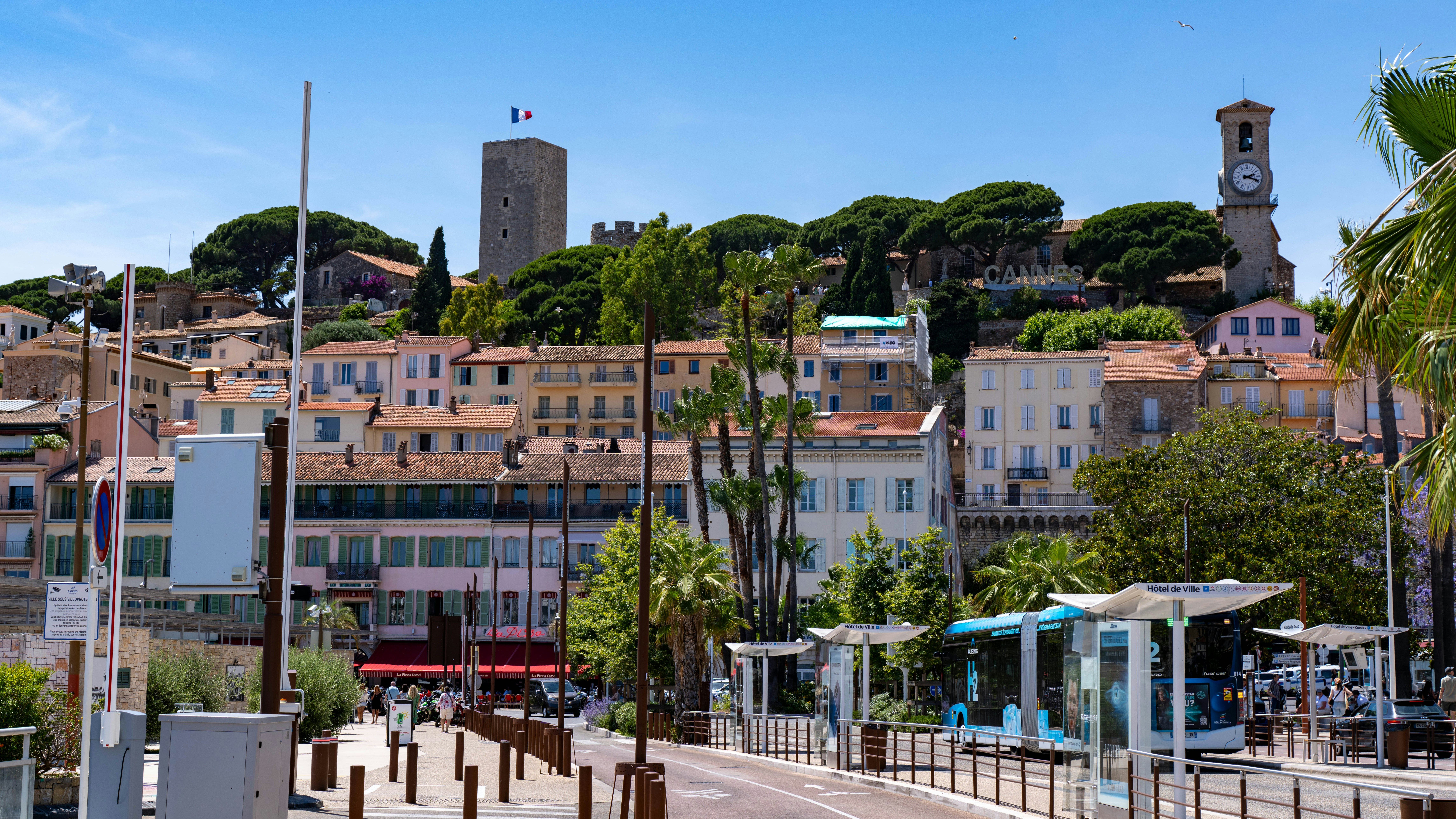 Mediterranean Harbor: A sunlit hillside town with pastel facades