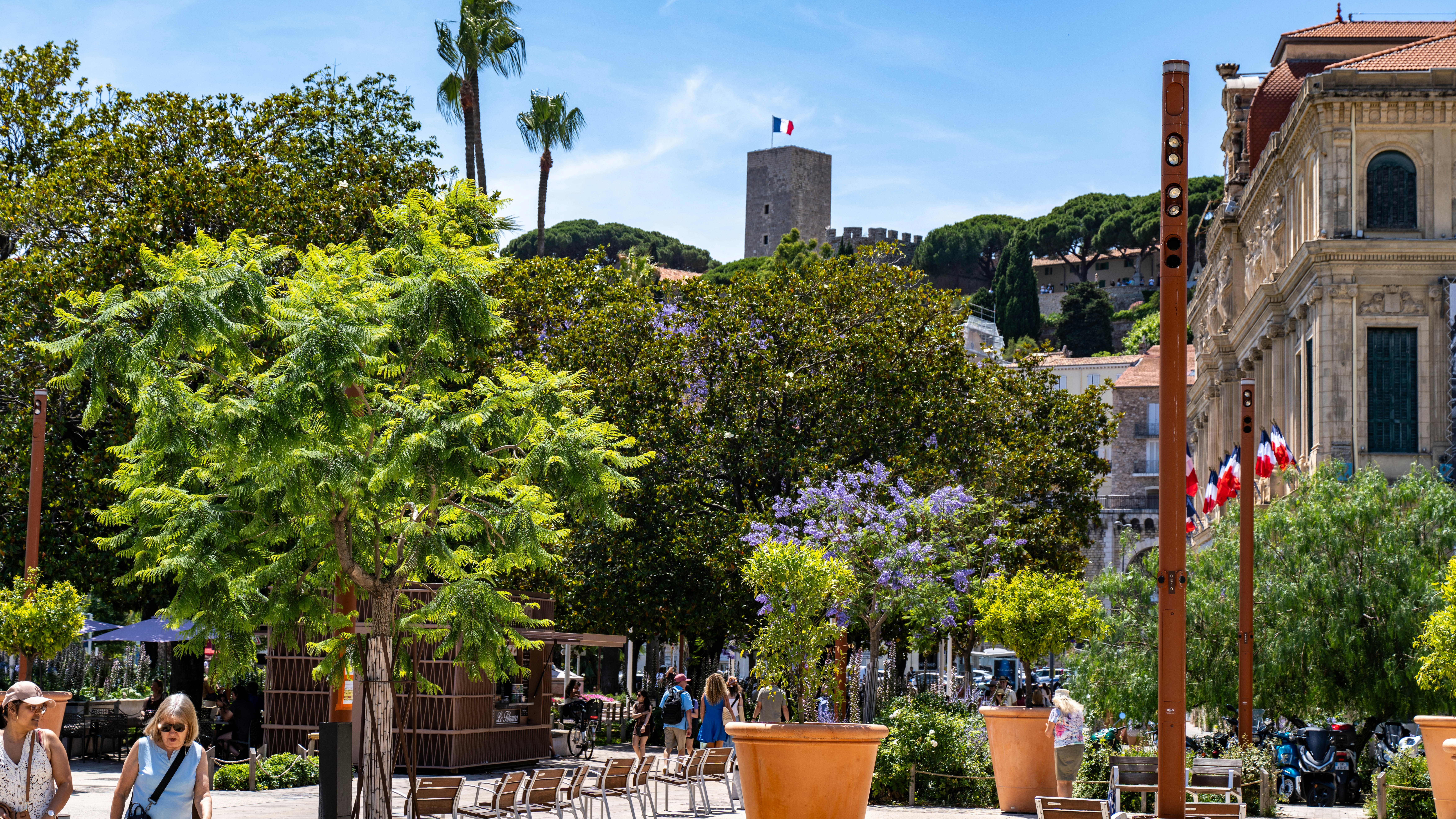 Sunlit Terrace Meets The Ancient Tower: A Mediterranean Plaza