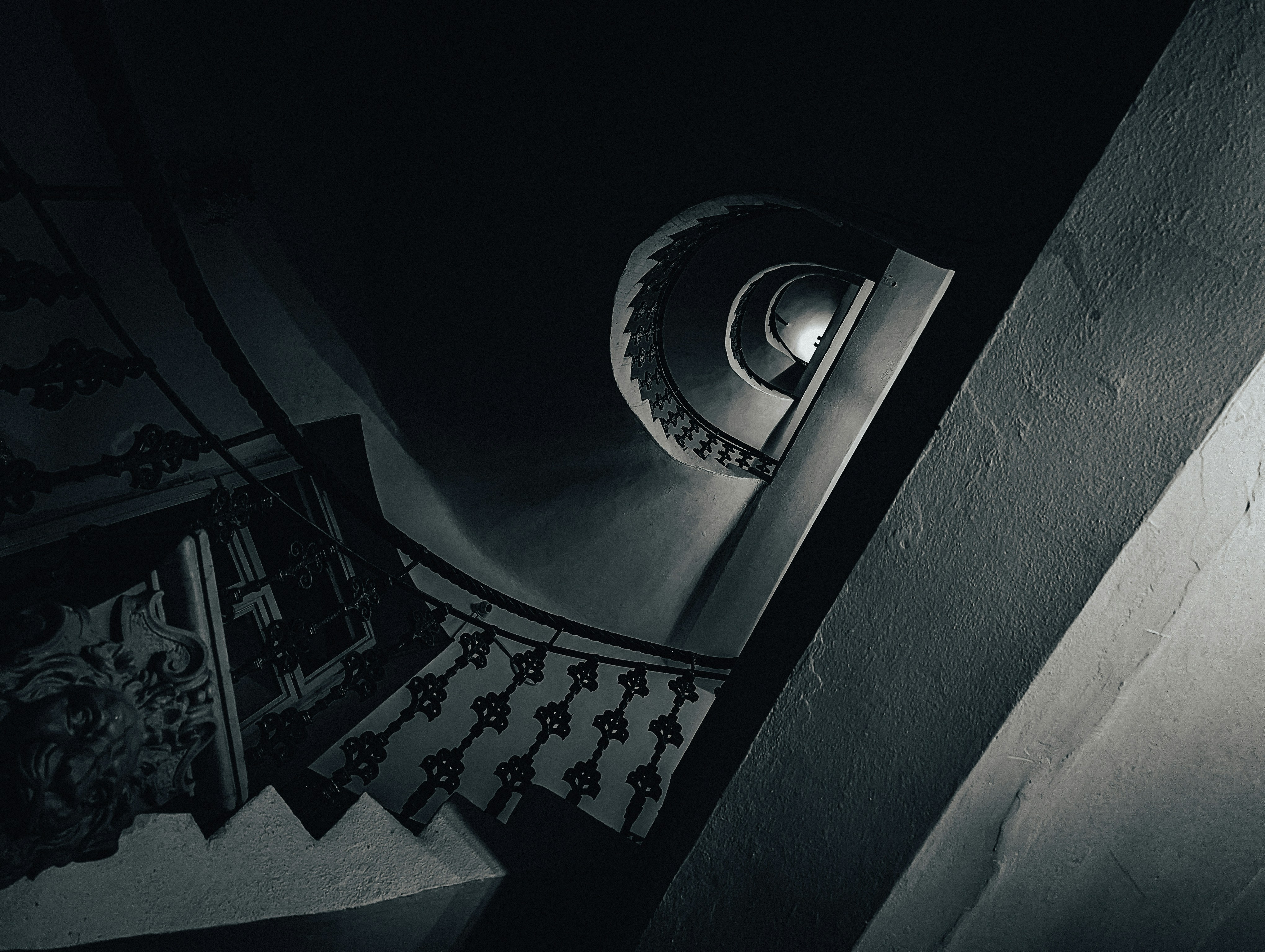 Spiral Descent: A Monochrome Staircase Drawn into the Void