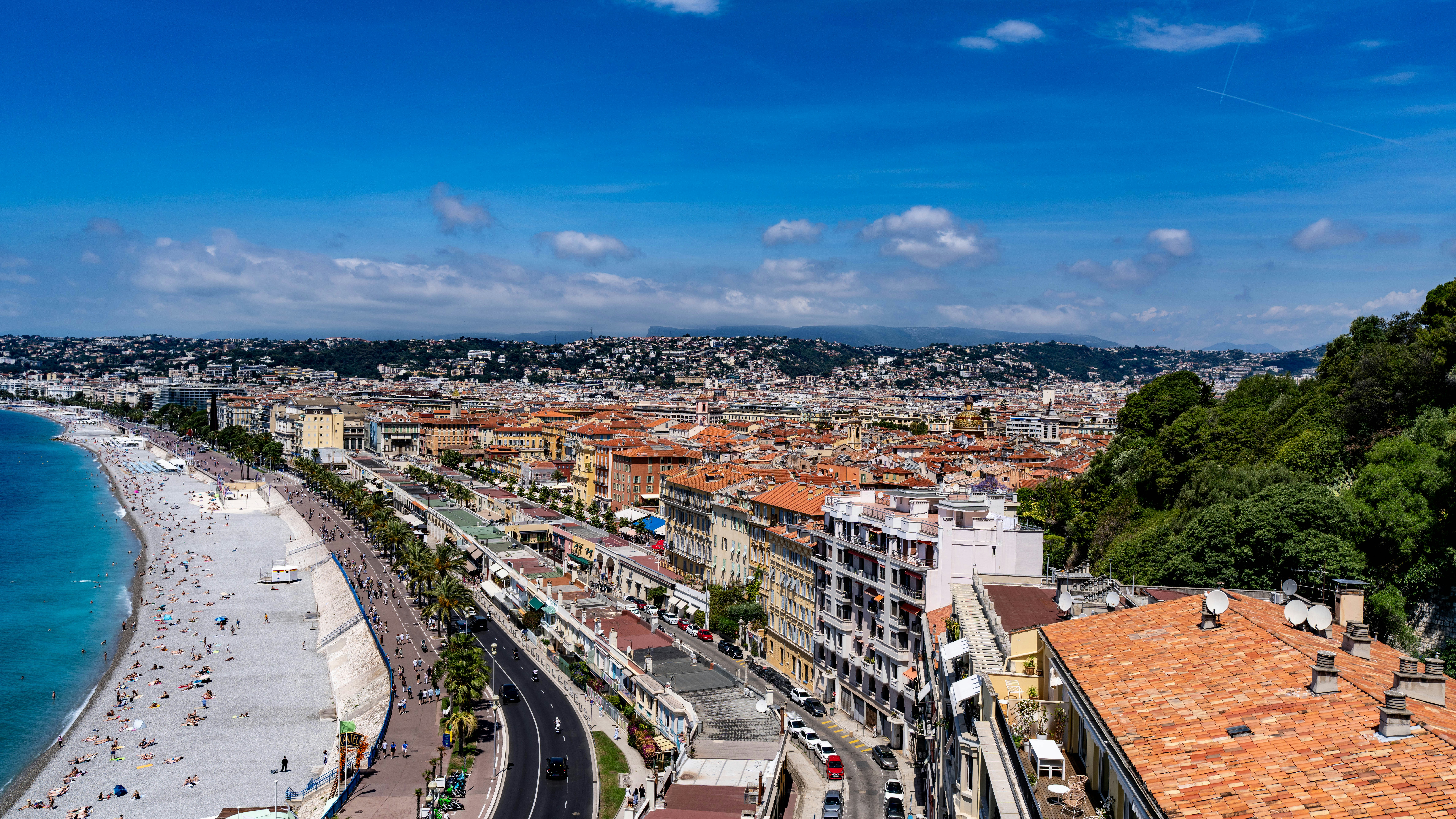 Mediterranean Cliffside Promenade: Coastal City in Sunlit Blur