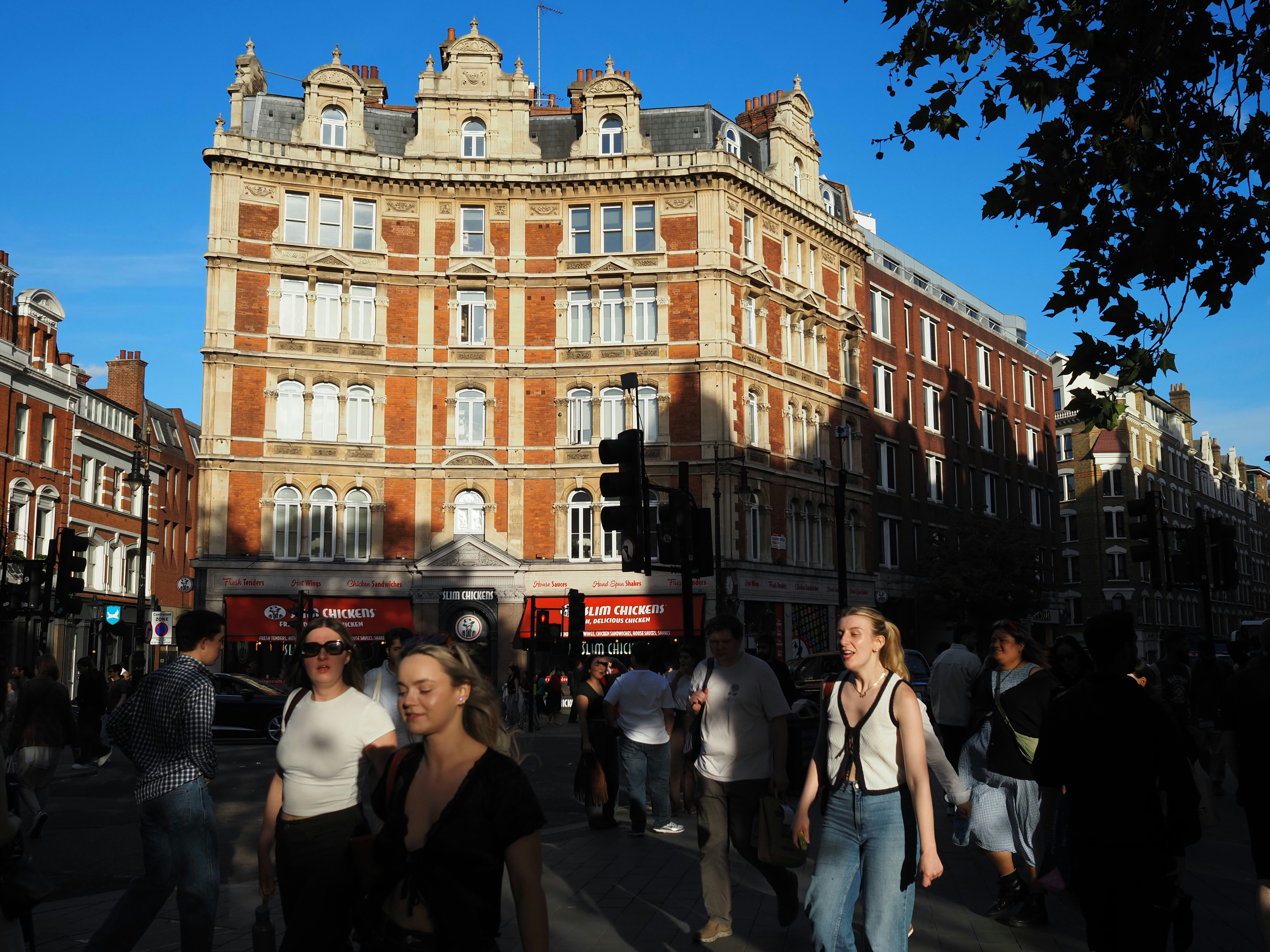 City Corner: The Busy Pedestrian Face of a Brick-Front Street