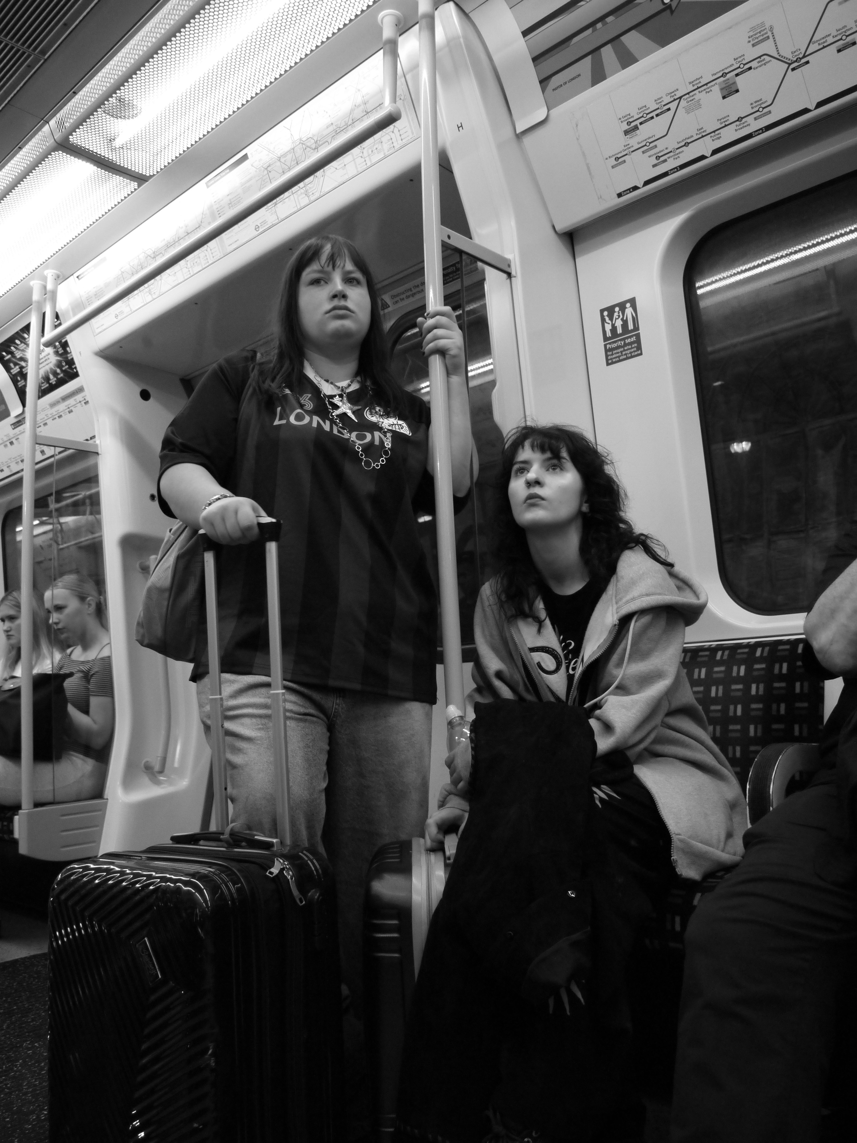Stranded in Transit: Quiet Gaze of the Station Companions