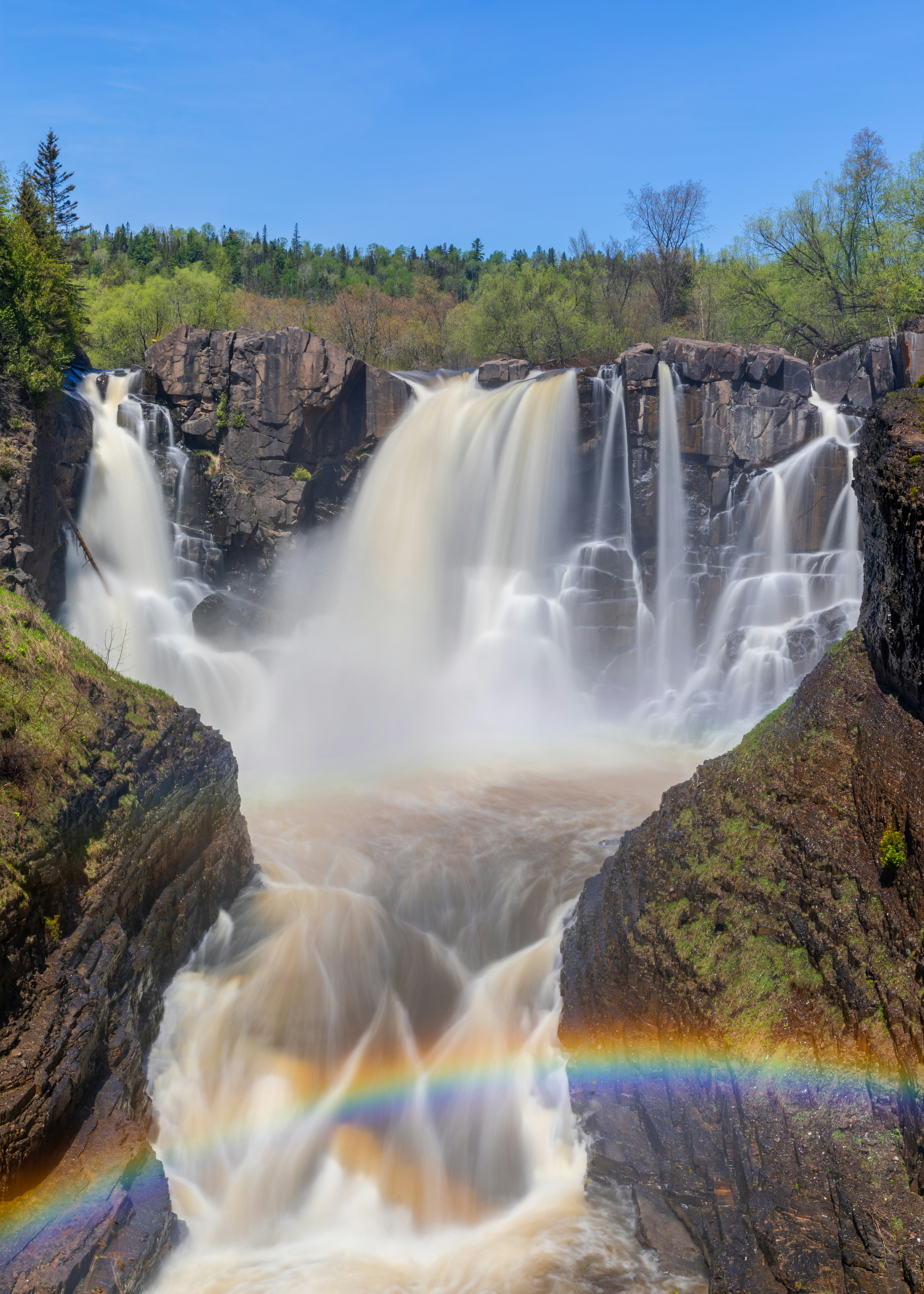 Cascading Veil: A Rainbow Rings the Falls