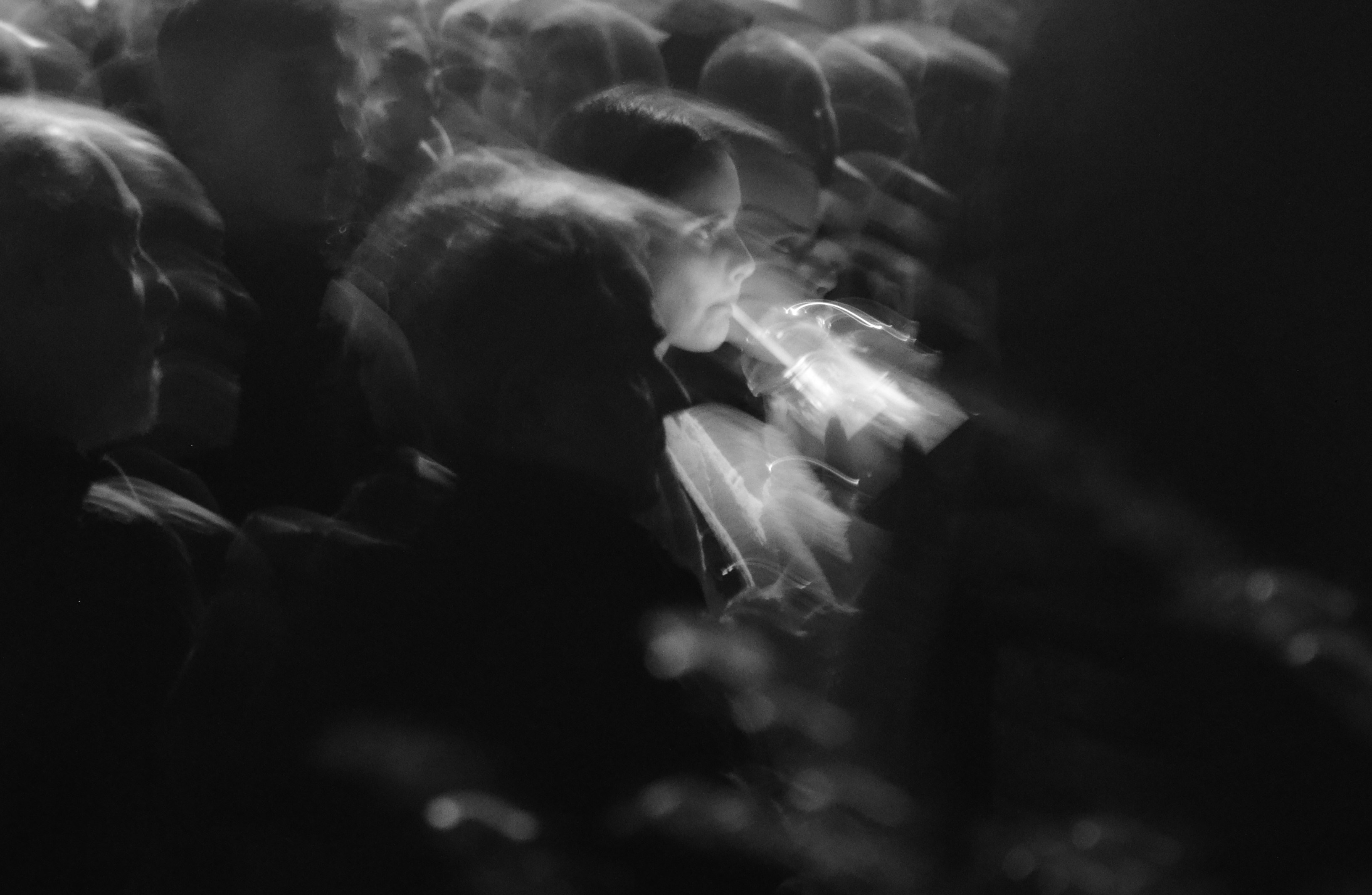Ghostly Convergence: A Fragmented Crowd in Low Light
