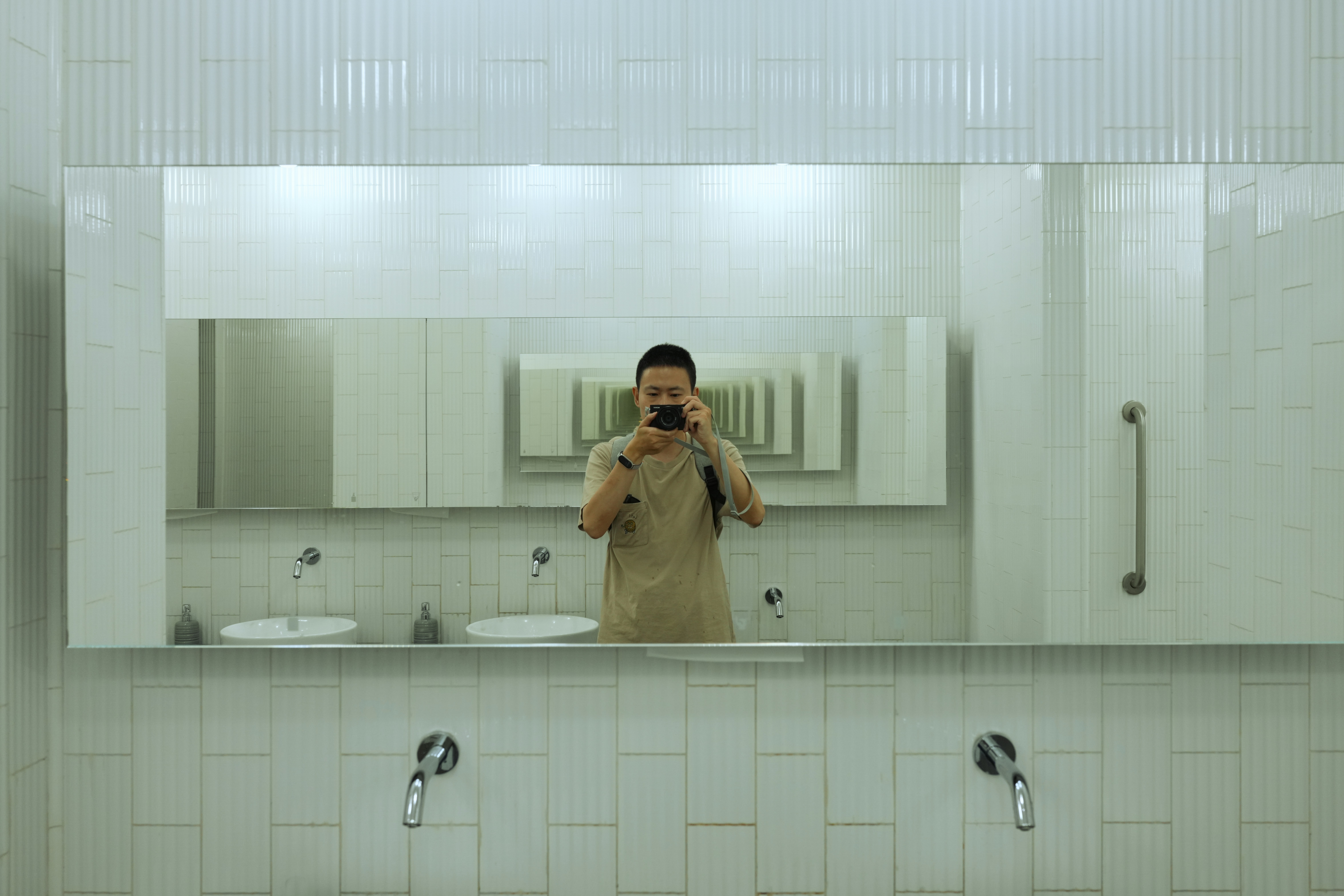 Mirror Maze Portrait: Selfie in a Symmetrical Restroom