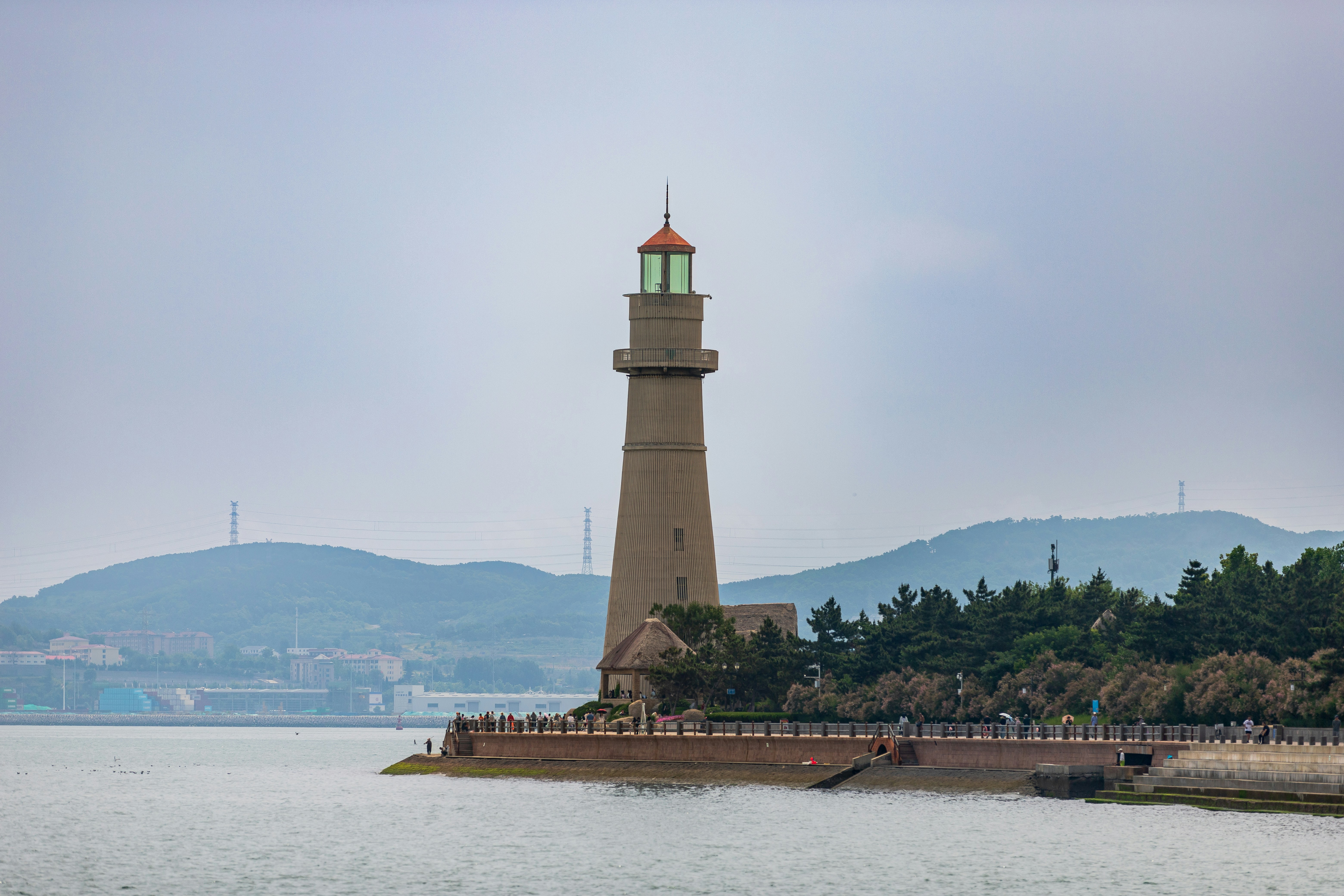 Lighthouse Sentinel at the Edge of Calm Waters