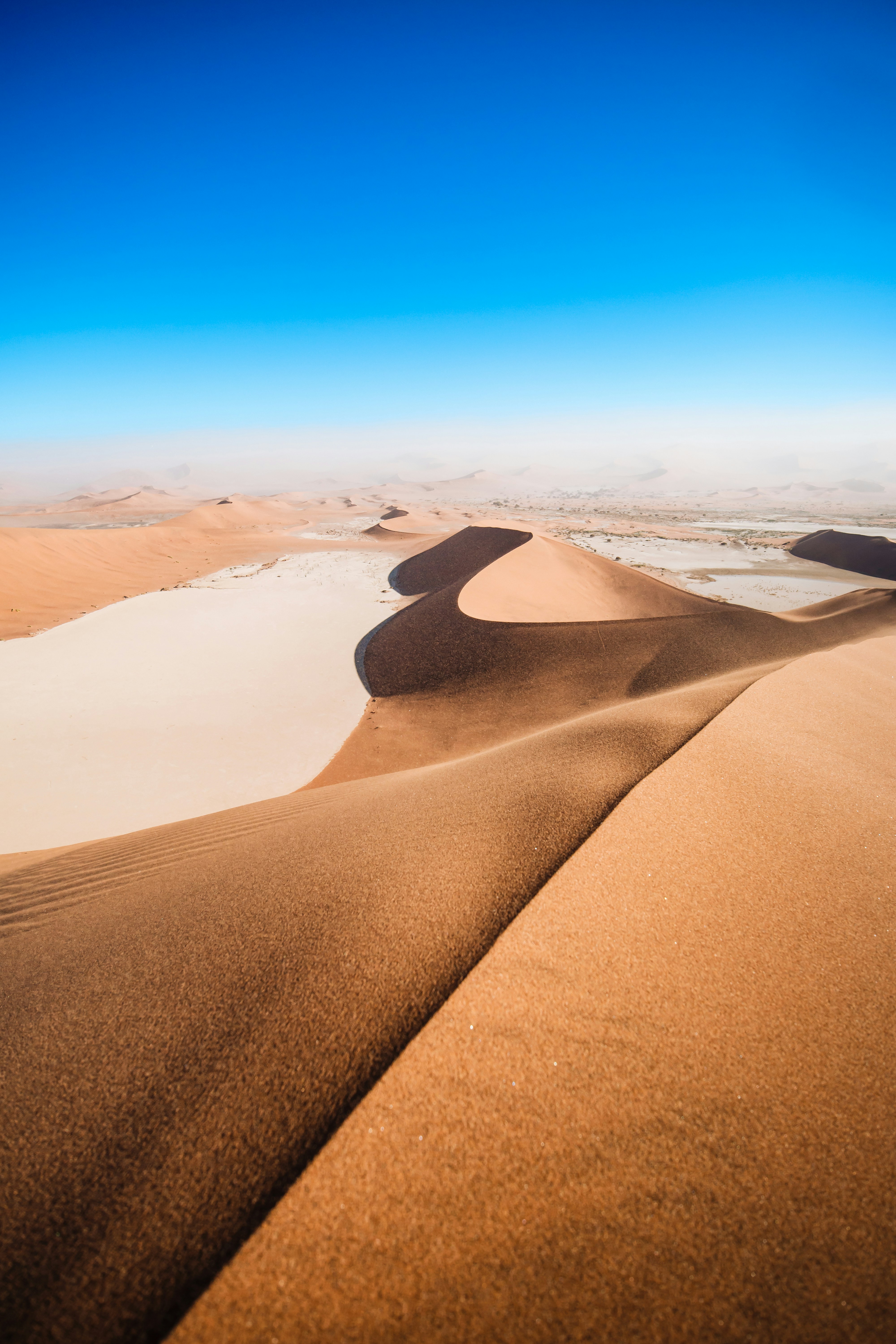 Dune Crestand: A Ribbon of Gold Sand under A Fading Sky