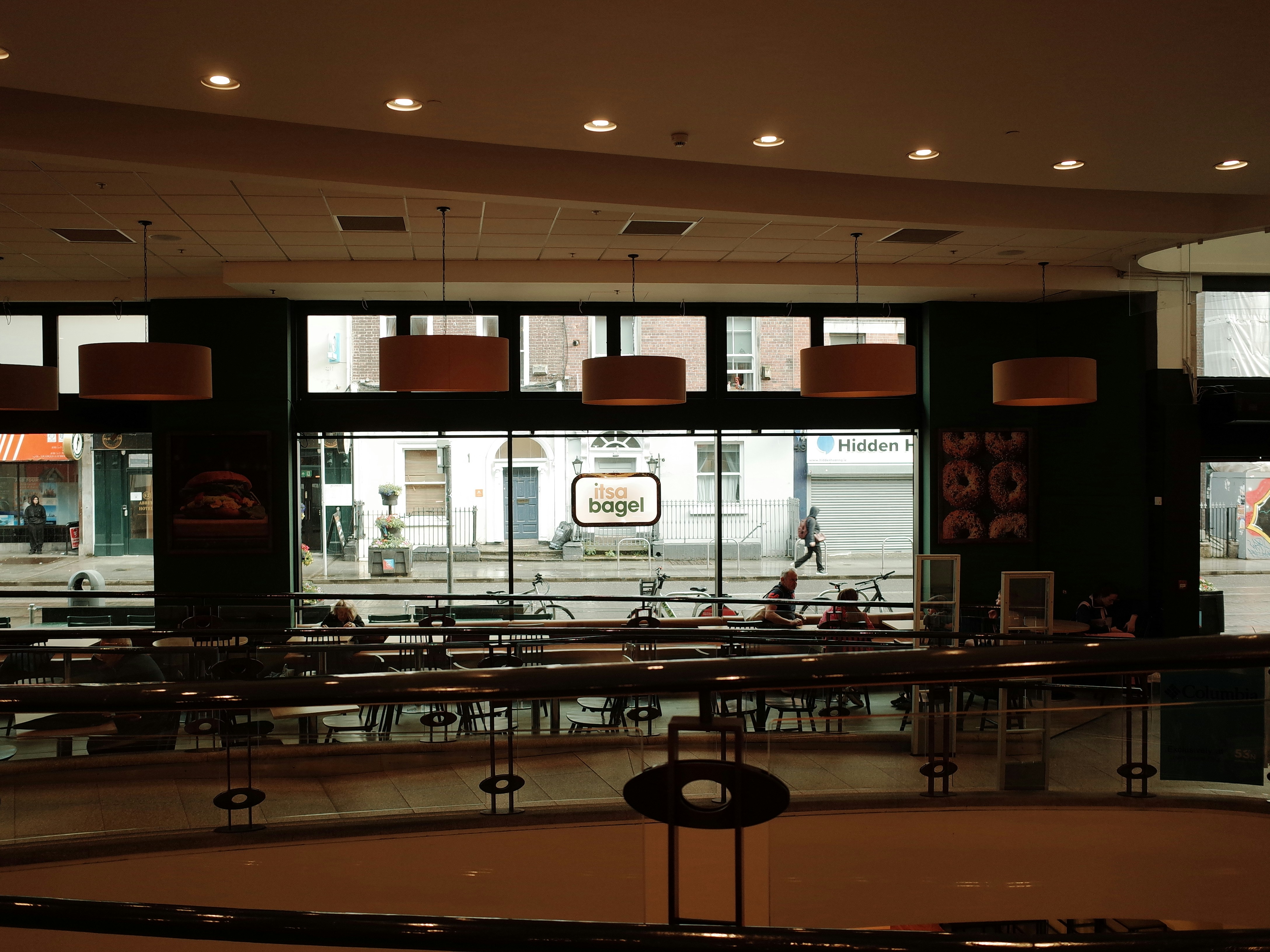 Cafe Interior Through the Front Window: Quiet Activity with Soft Evening Light