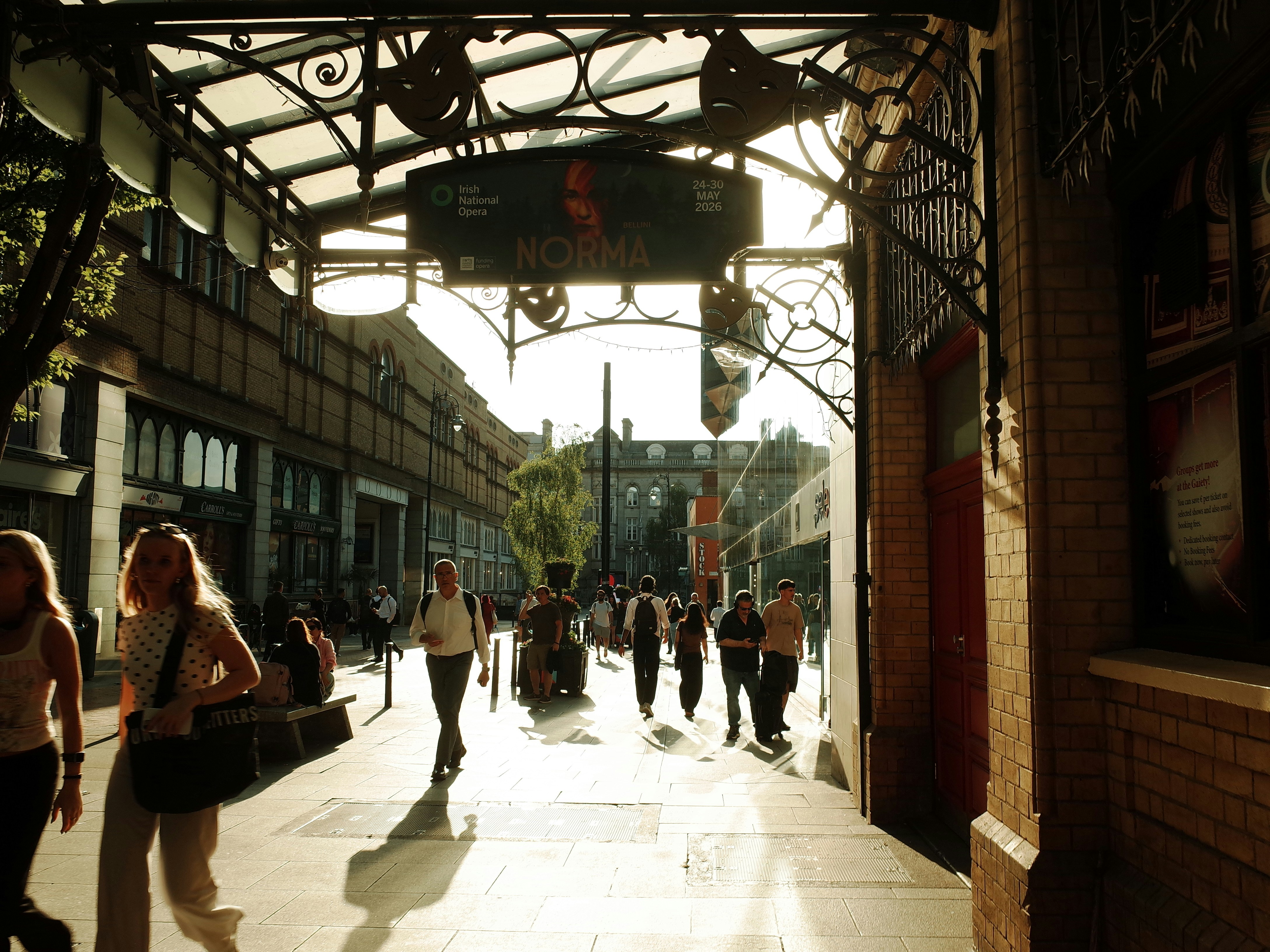 Golden Hour Crossing under the Clockwork Arch