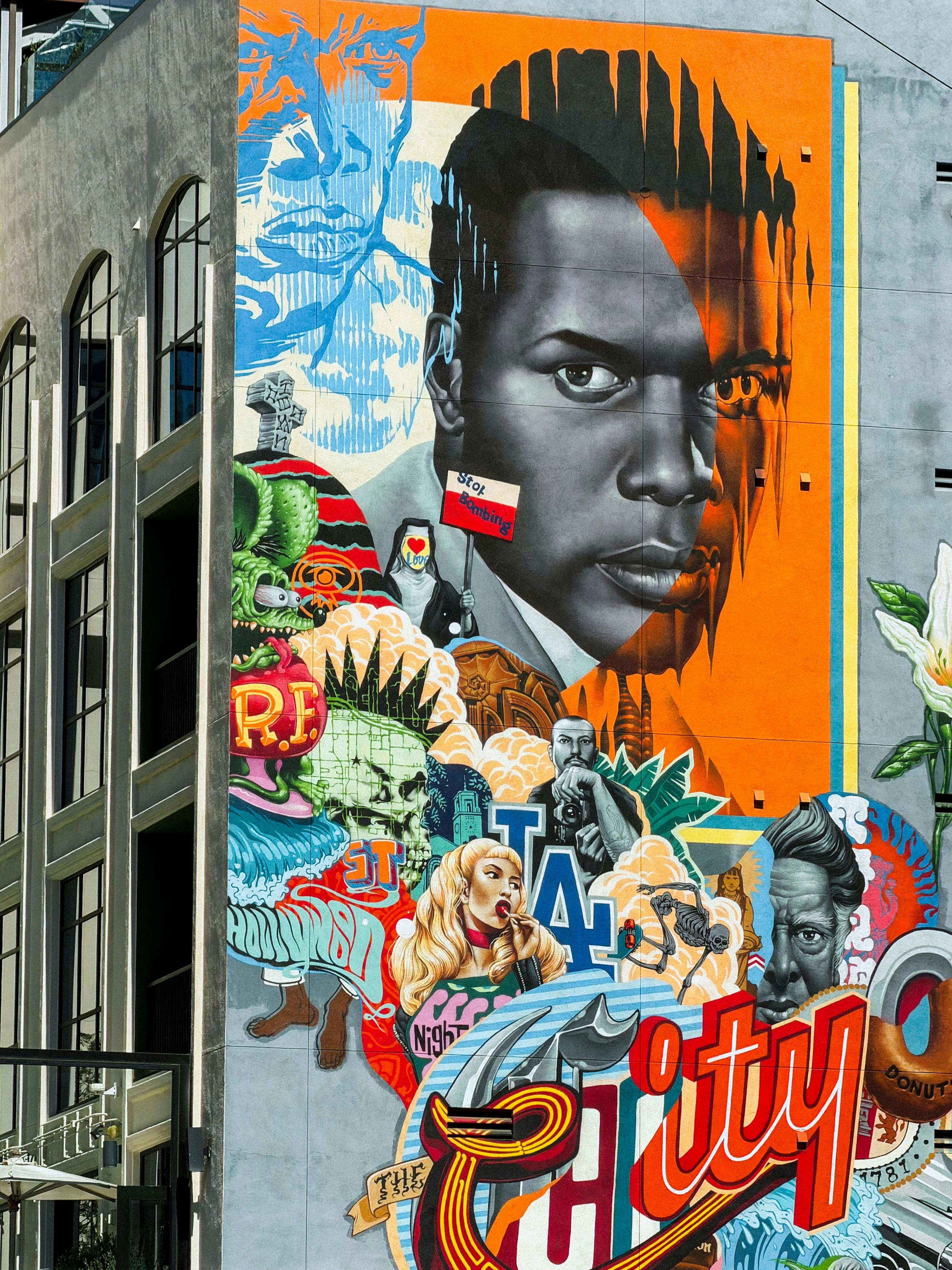 Urban mural: A towering portrait anchors a mosaic of pop culture and color