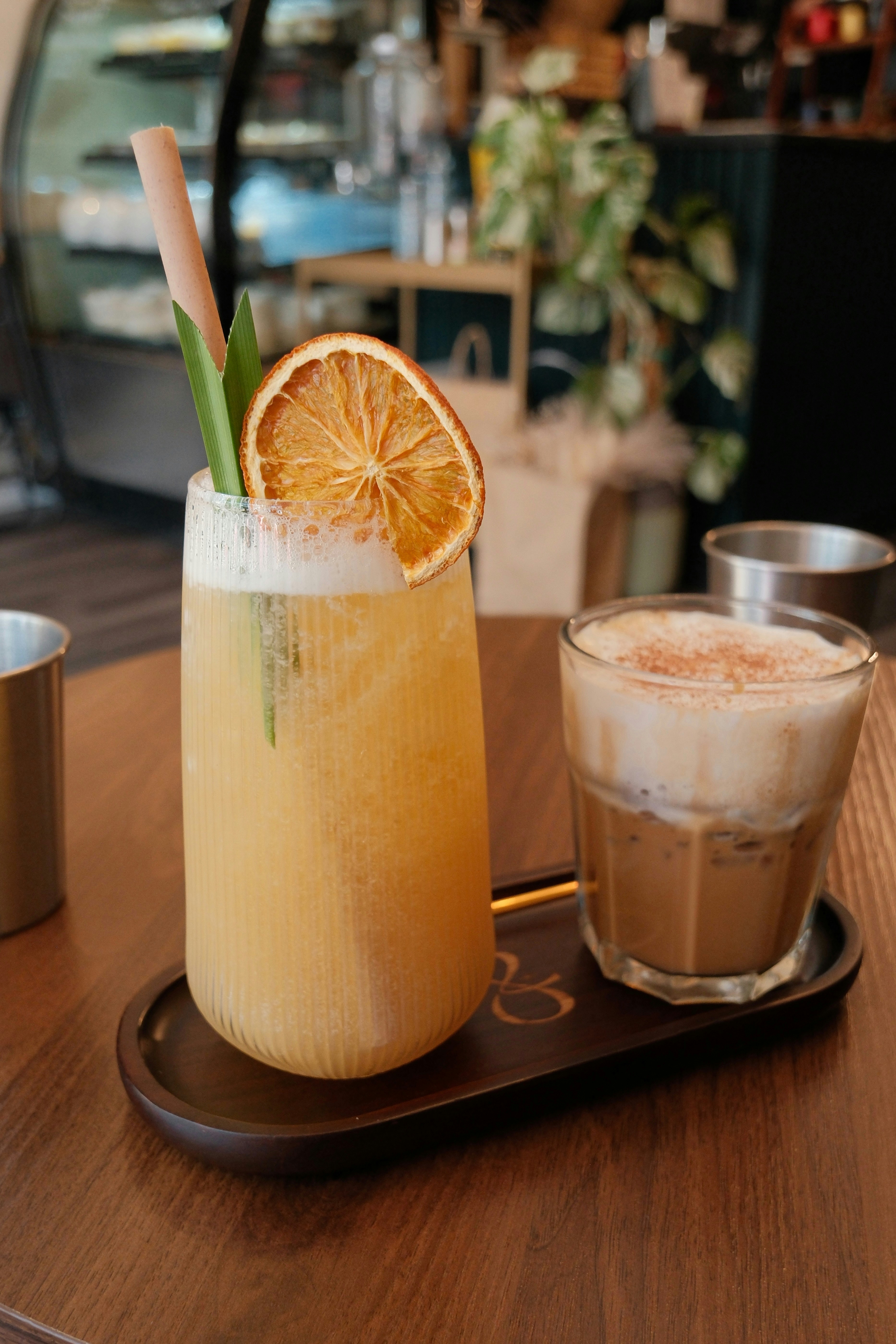 Sunlit Citrus Café: A Tall Glass and Its Creamy Companion