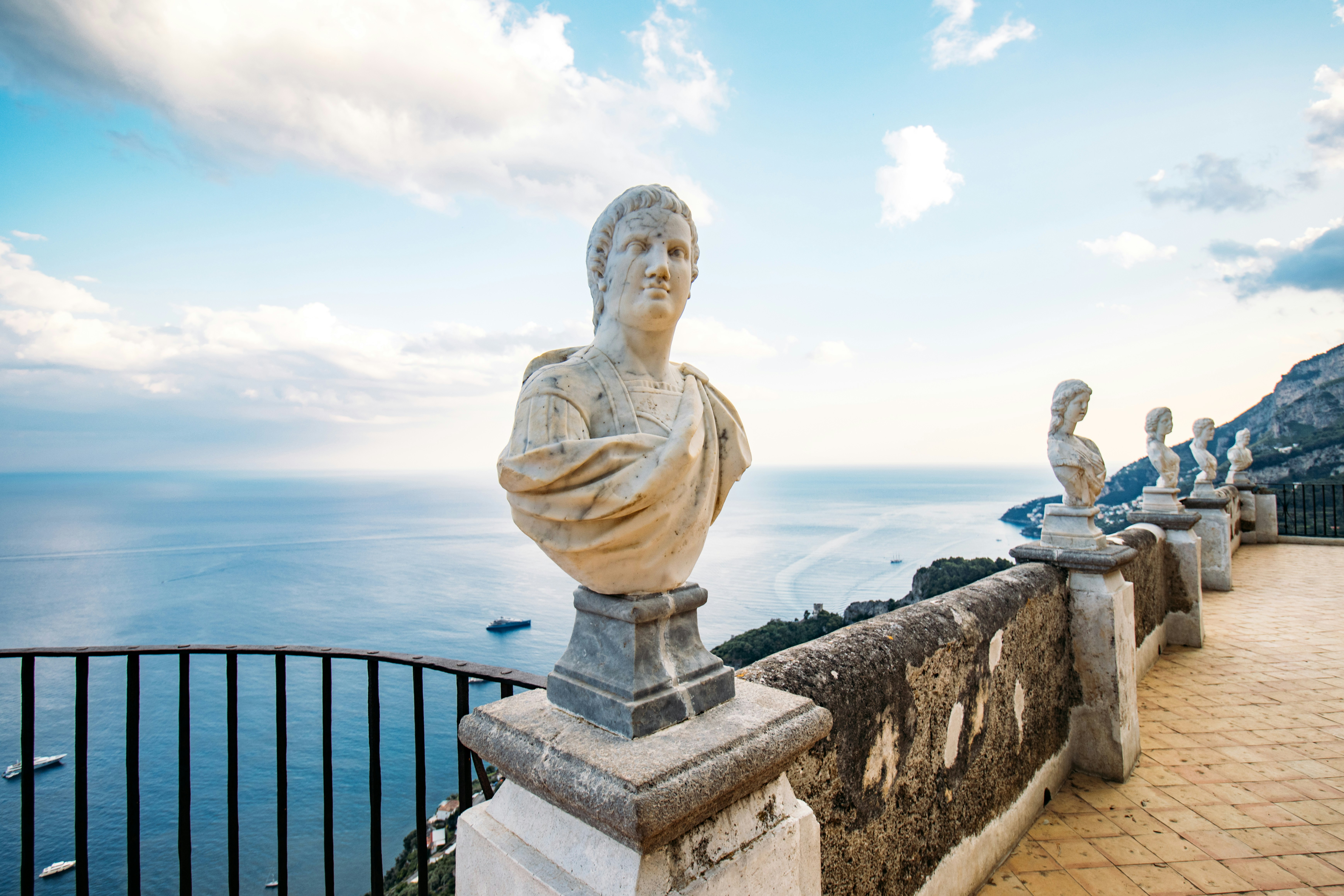 Sea-Edge Carved Gaze: Busts Guarding a Coastal Promenade