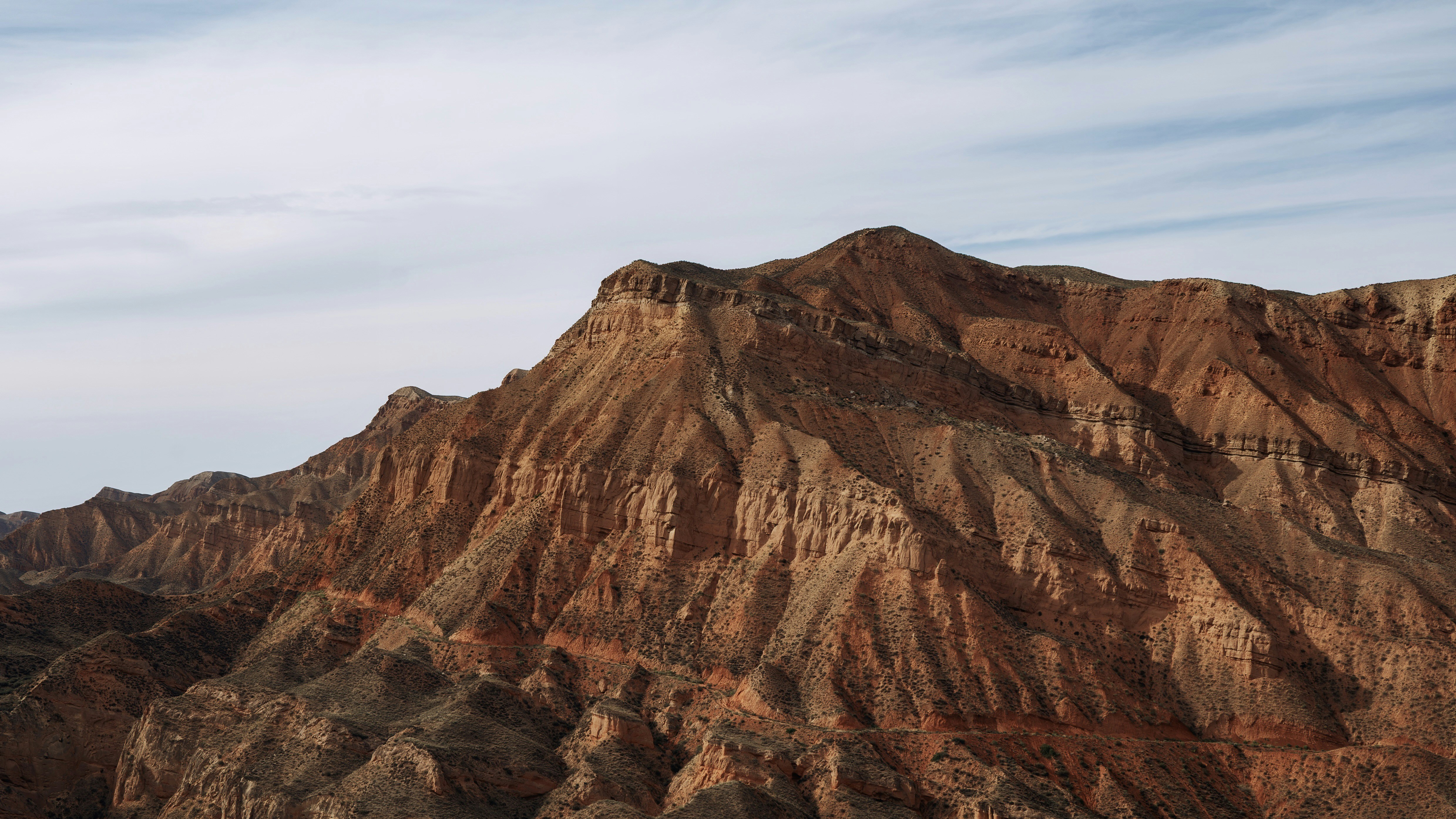 Desert Ridge at Dusk: Strata of Color and Light