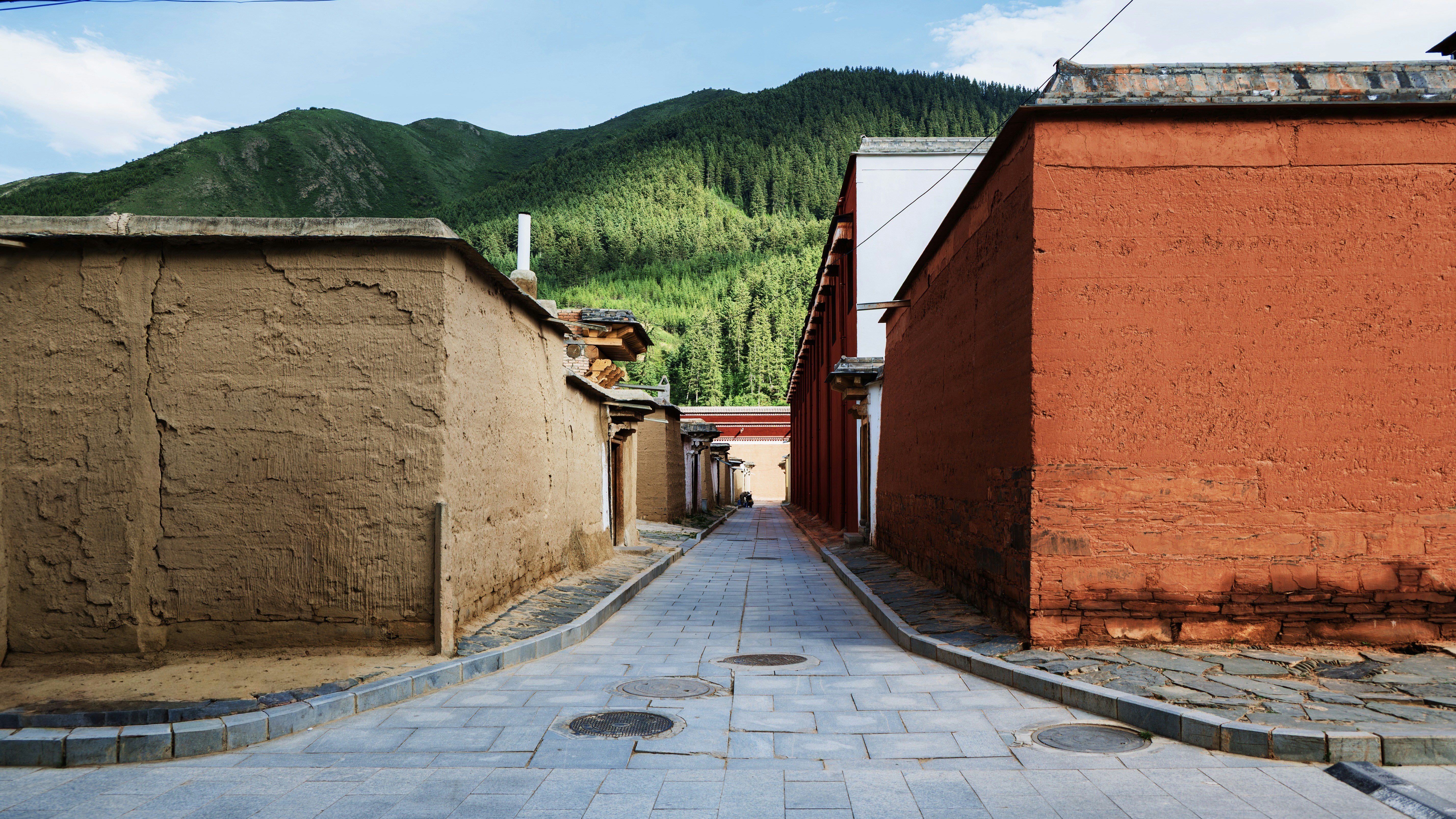 Tunnel of Colors: A Quiet Alley Between Terracotta Walls