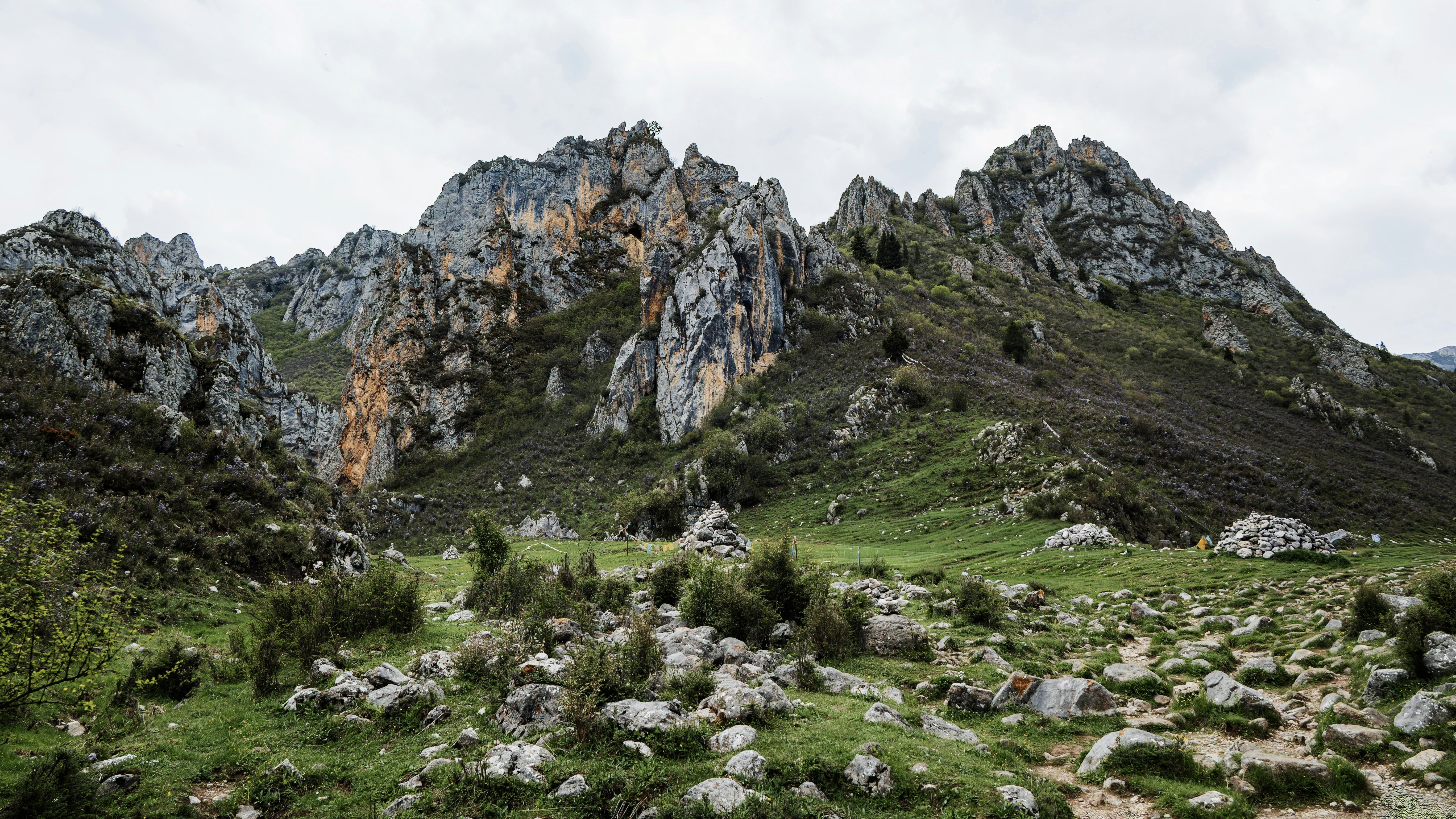 Rugged Peaks Over a Quiet Teres of Stone and Grass