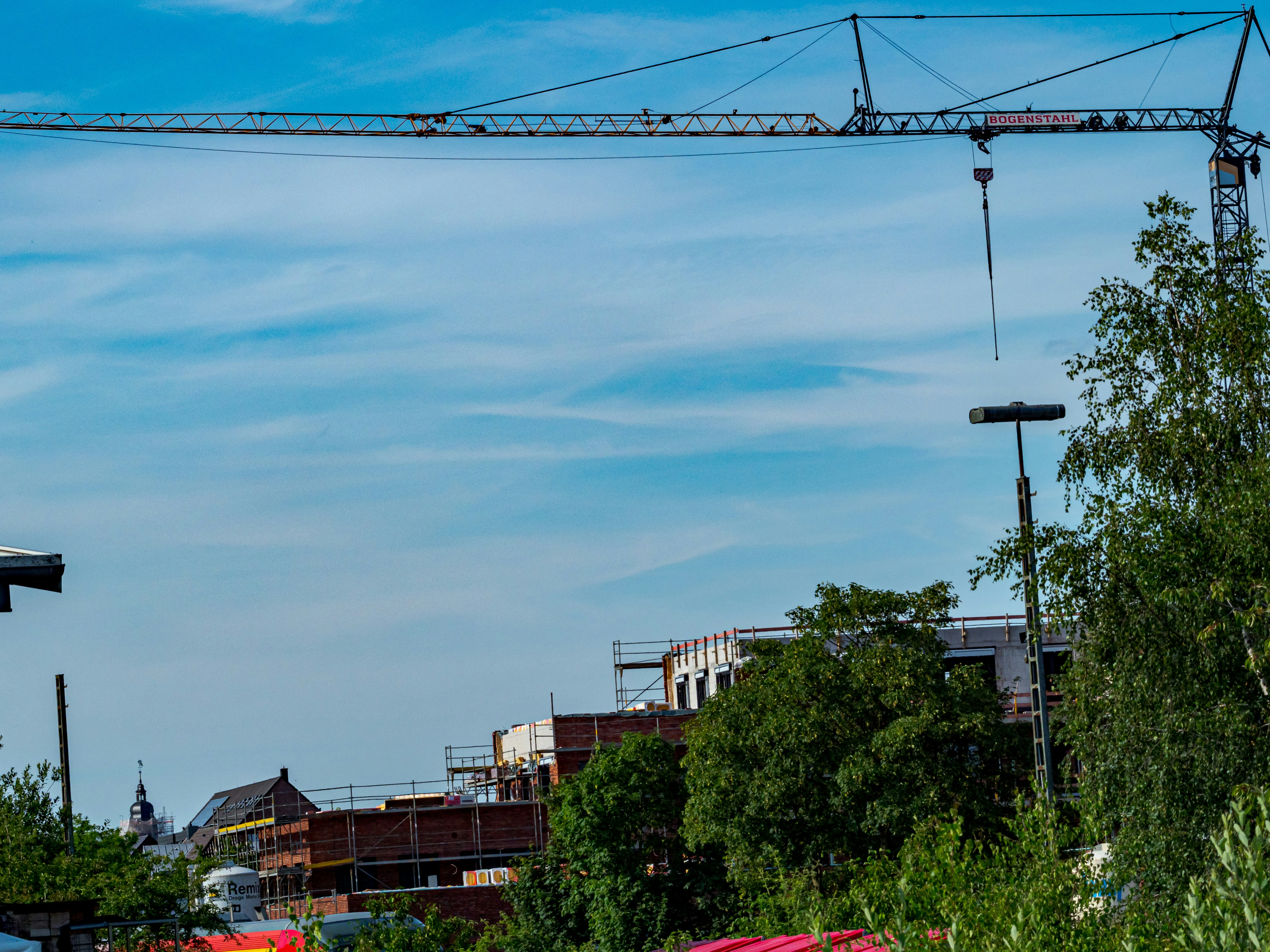 Crane Span Over a Cityscape Under a Clear Sky