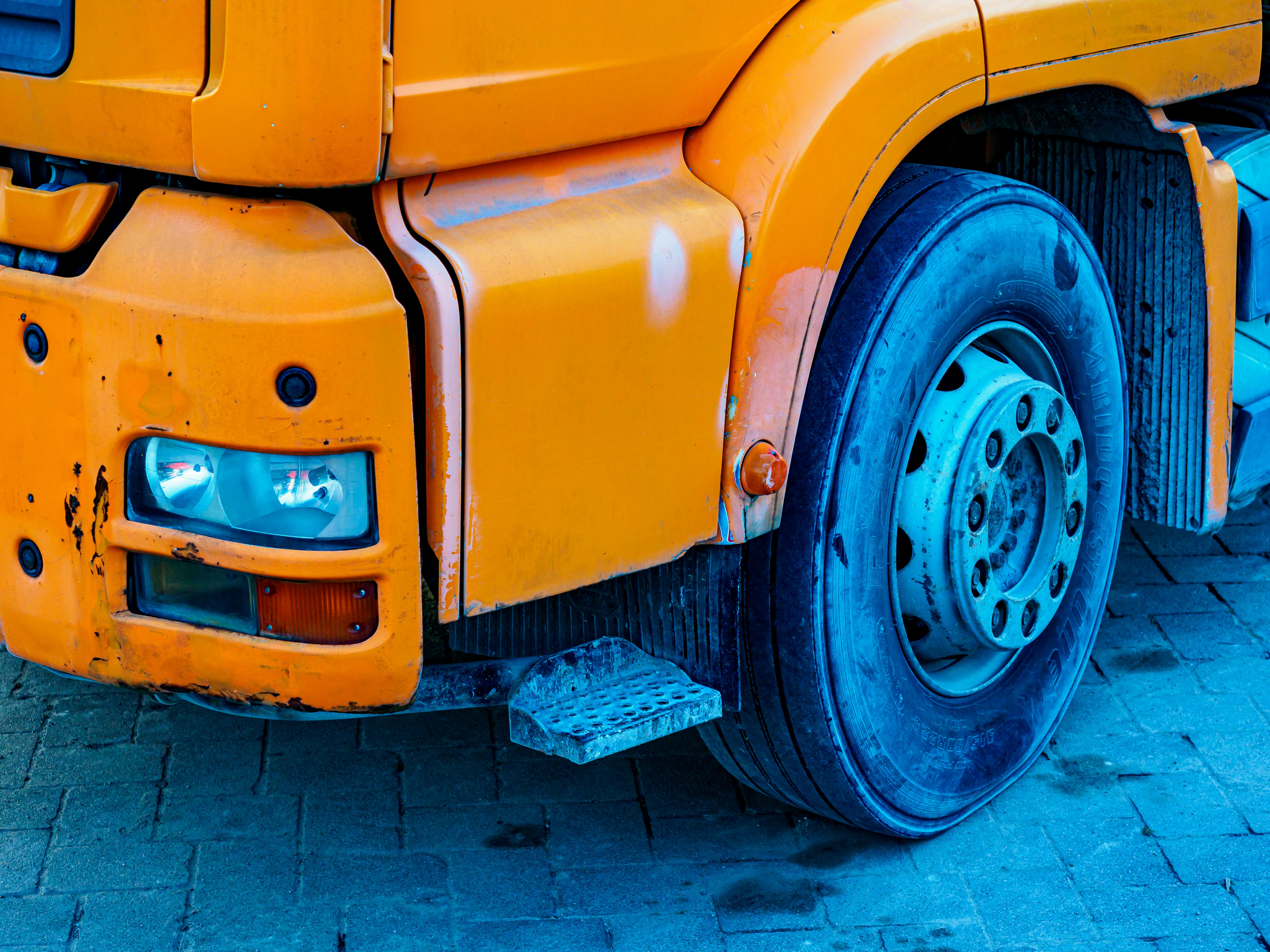 Yellow Beast: the front-left view of a worn yellow truck